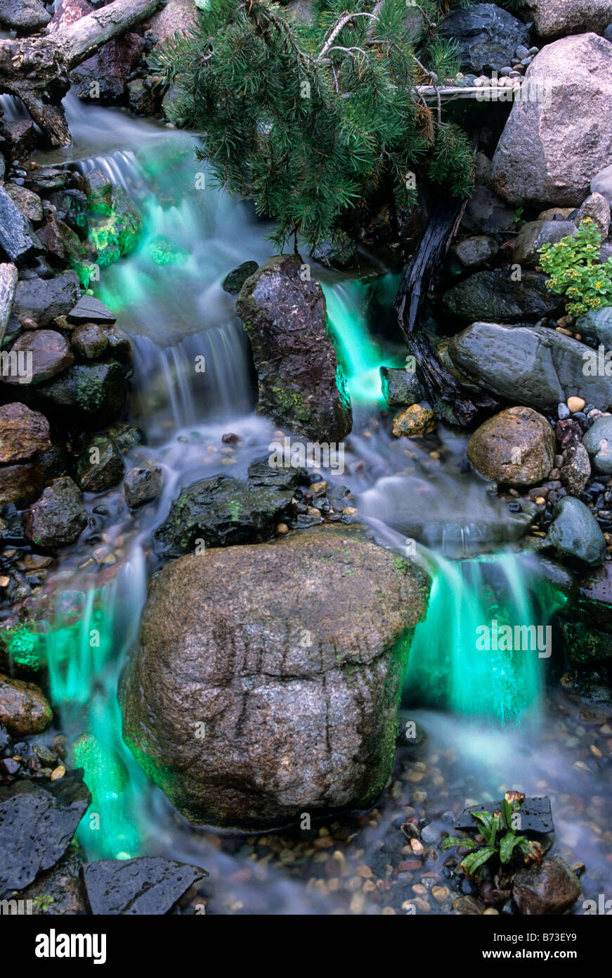CHANGING COLORS BELOW GARDEN WATERFALLS CREATED BY UNDERWATER FIBER ...