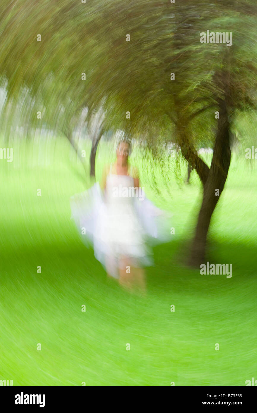 Young woman dancing blurred motion Stock Photo - Alamy