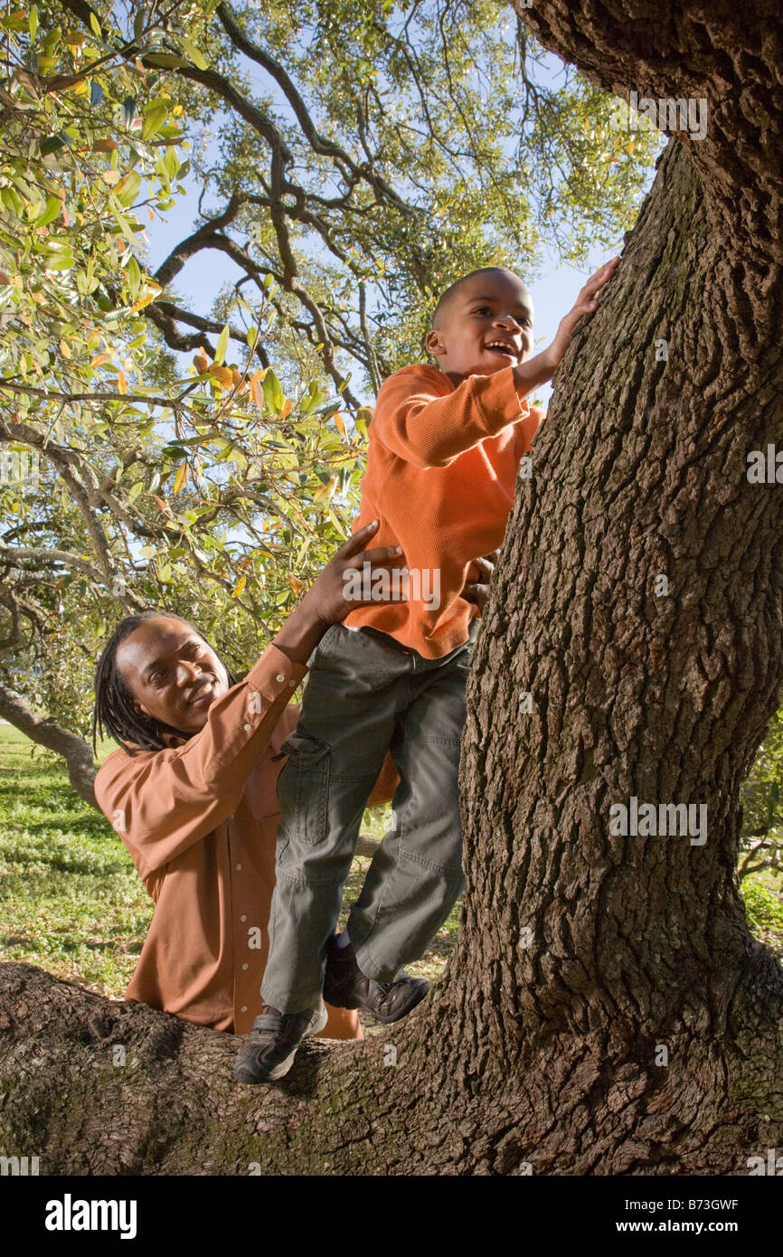 Child climbing tree oak hi-res stock photography and images - Alamy