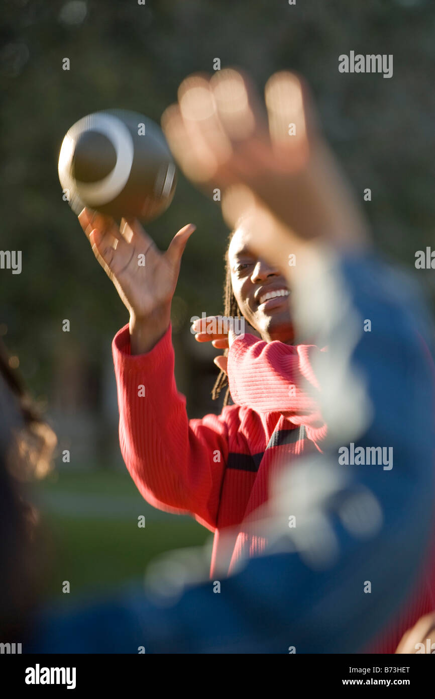African American man throwing football in park Stock Photo - Alamy