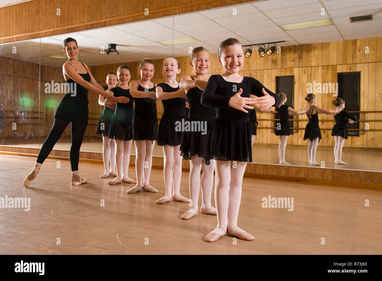 Young ballerinas with dance instructor in studio Stock Photo - Alamy