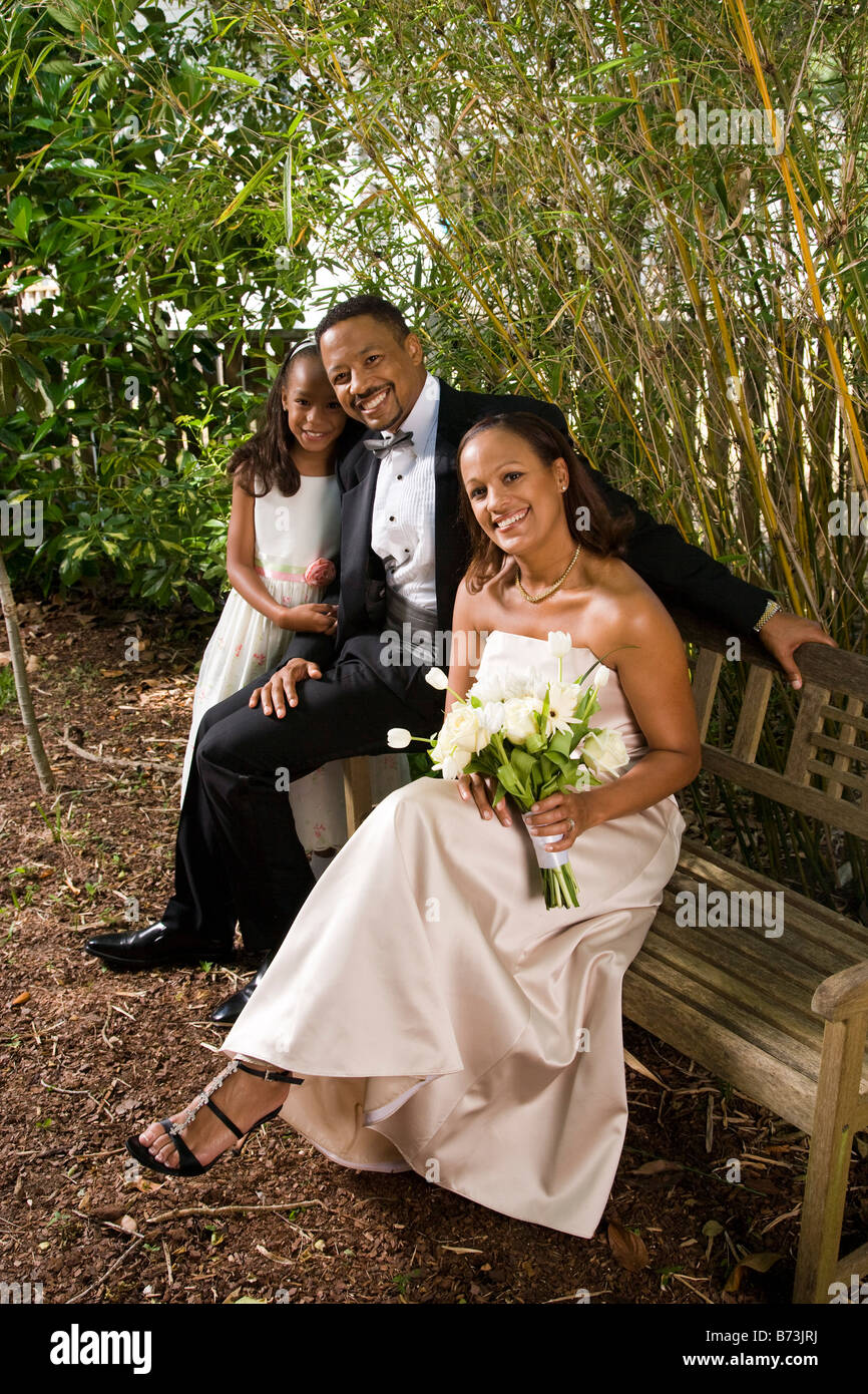 Happy African American bride and groom in outside nature setting with ...