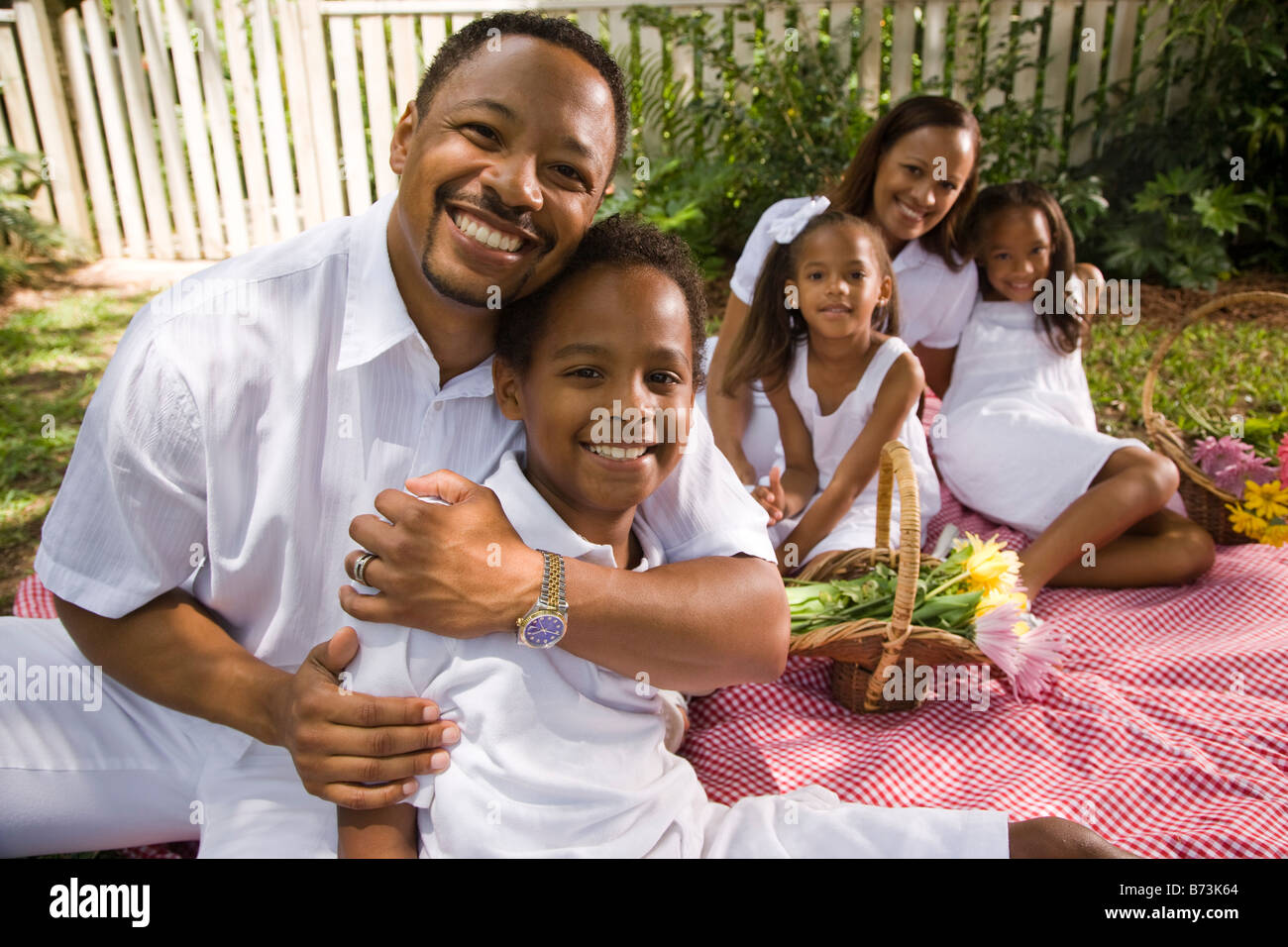 Happy African-American family enjoying picnic in back yard Stock Photo ...