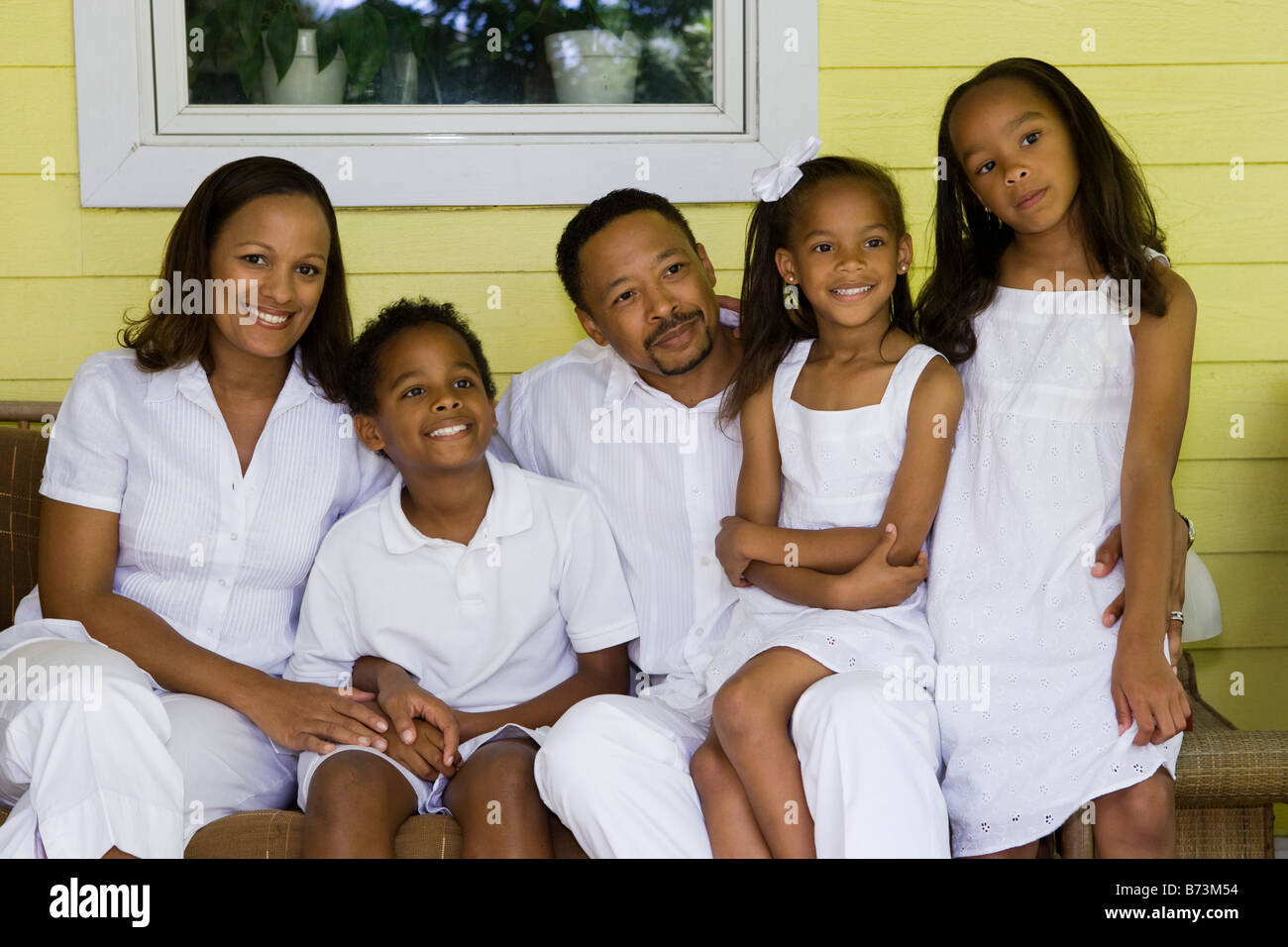 Happy African American family posing for family portrait outside on ...