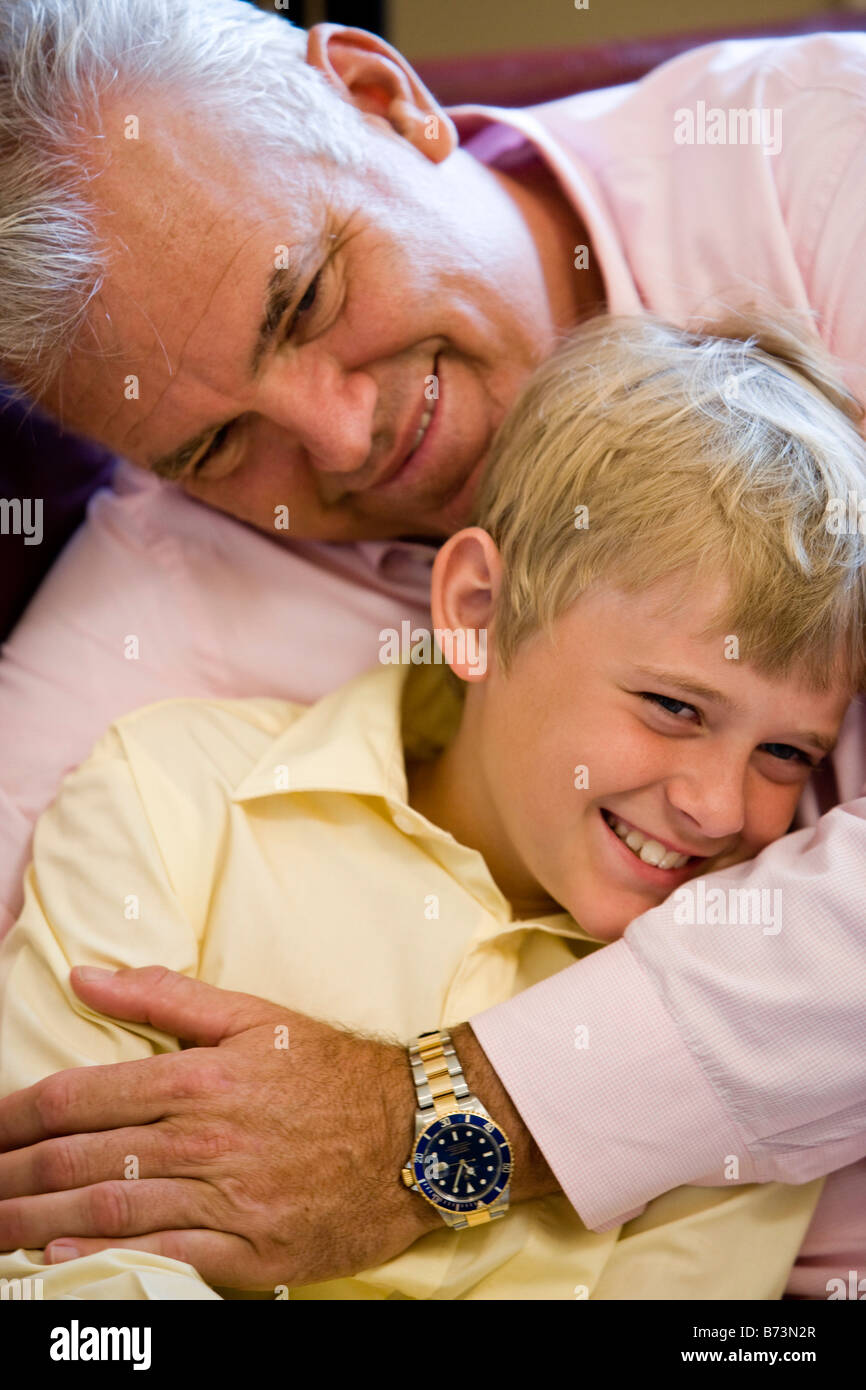 Close-up of grandfather hugging child Stock Photo - Alamy