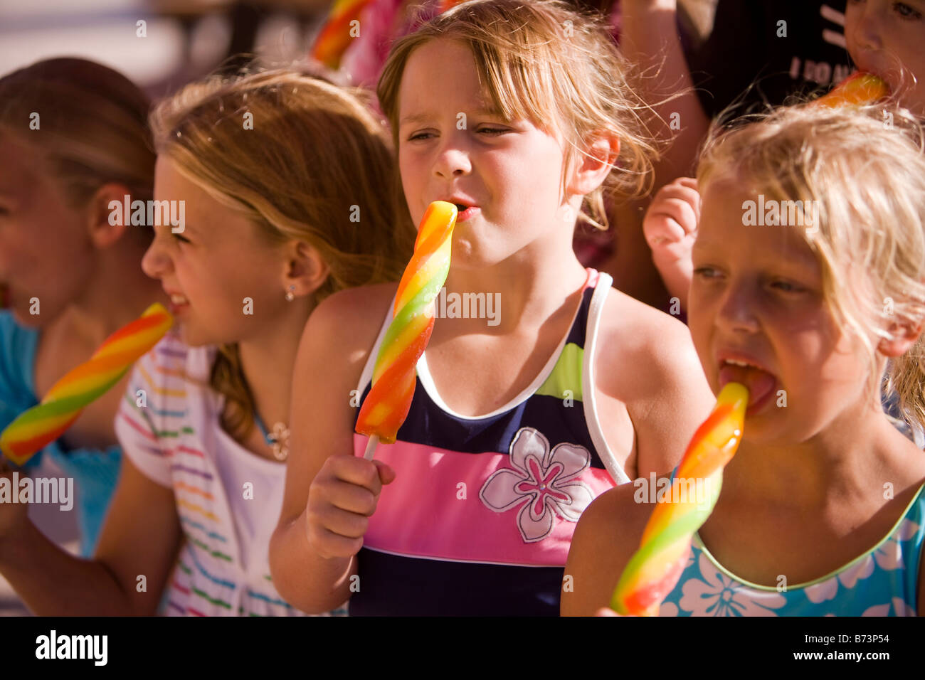 Group of children enjoying popsicles Stock Photo - Alamy