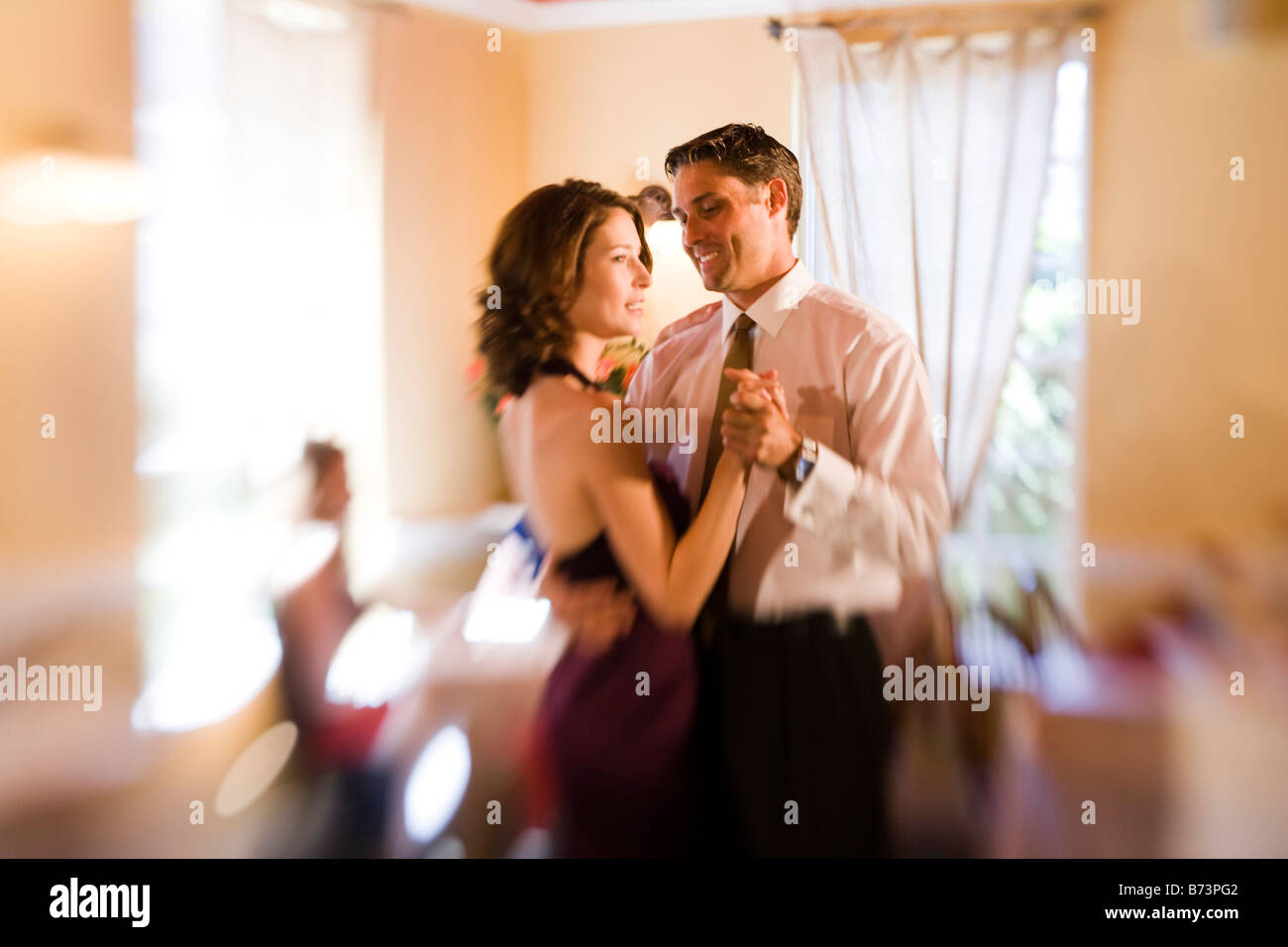 Closeup of romantic couple dancing in restaurant Stock Photo - Alamy