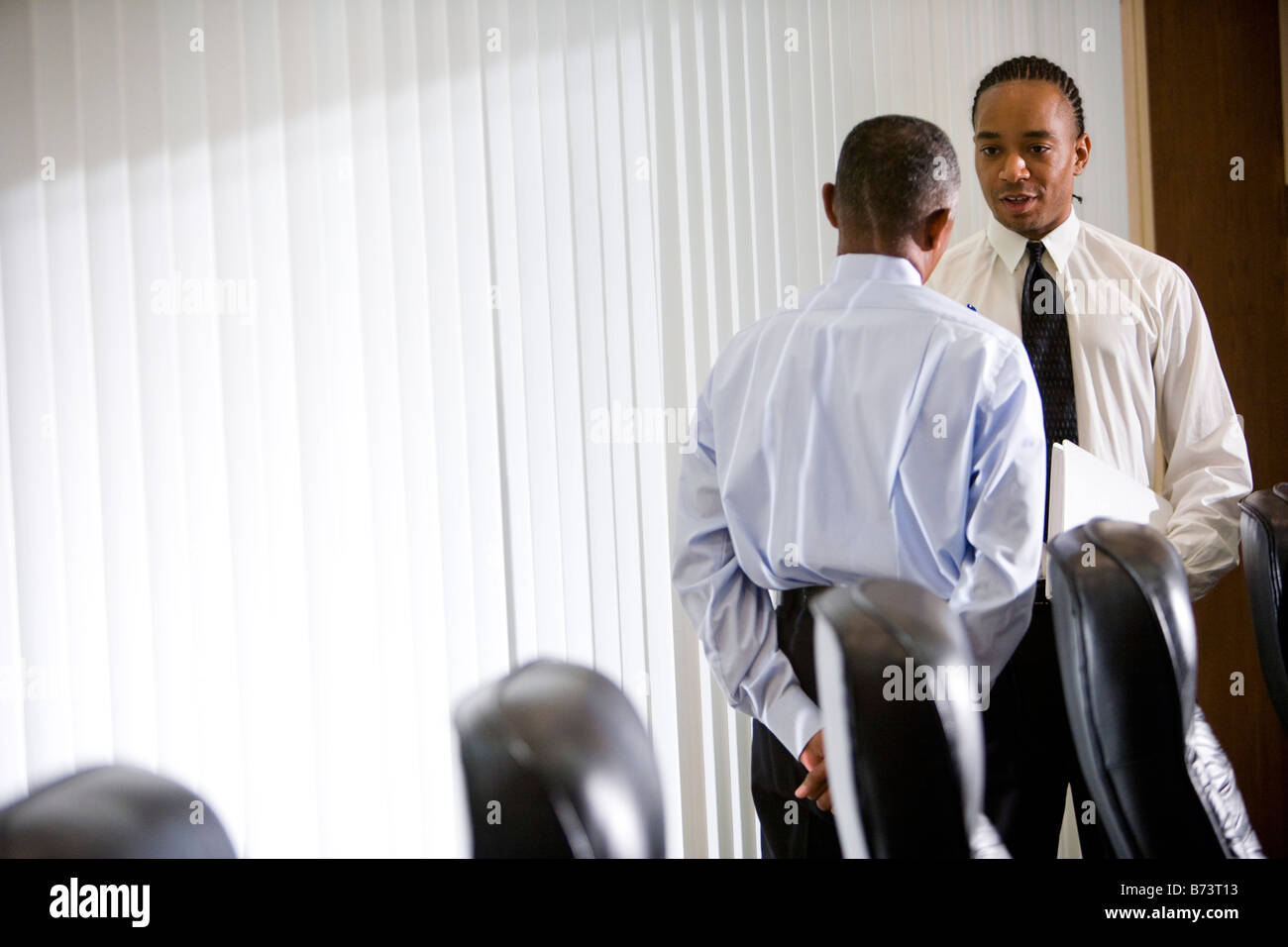 African-American businessmen in boardroom having discussion Stock Photo ...
