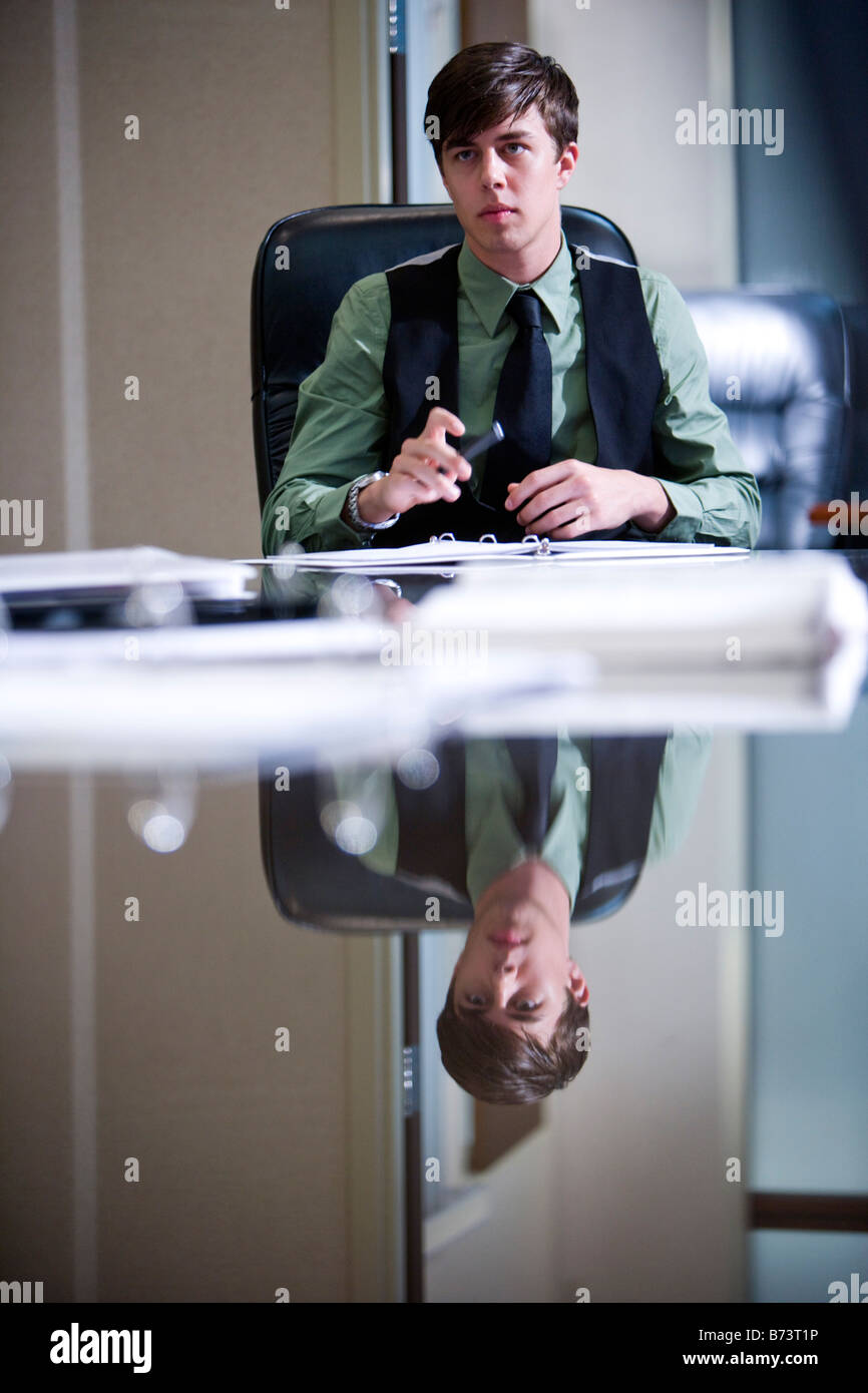 Young office worker reviewing paperwork Stock Photo - Alamy