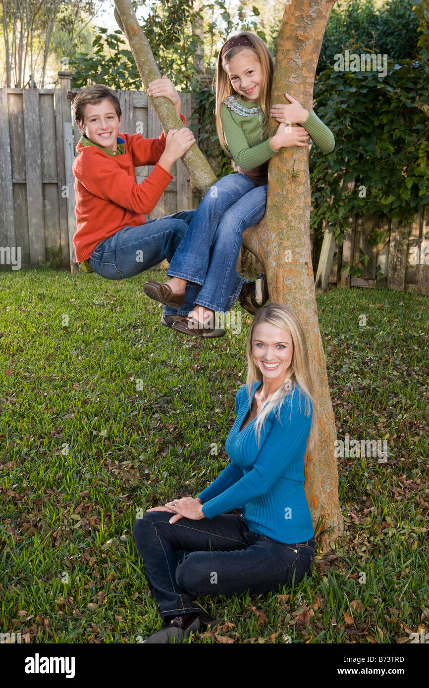 Girl in backyard climbing in tree hi-res stock photography and images ...