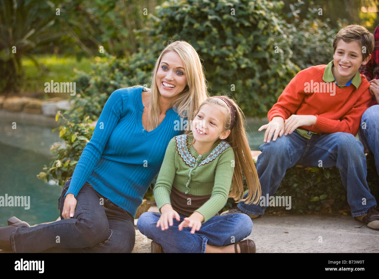 Young happy family outdoors observing nature Stock Photo - Alamy
