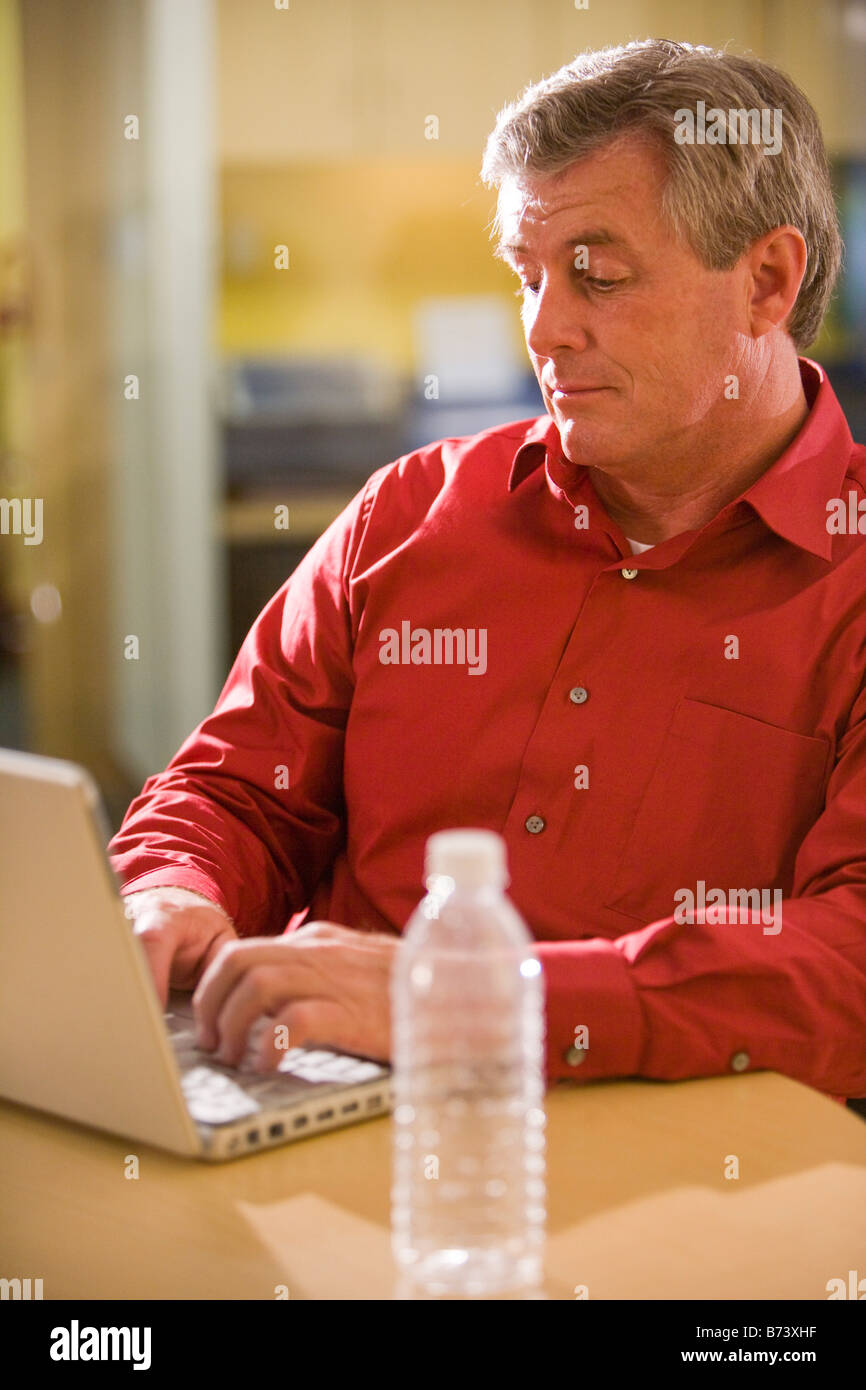 Male businessman working on computer hi-res stock photography and ...