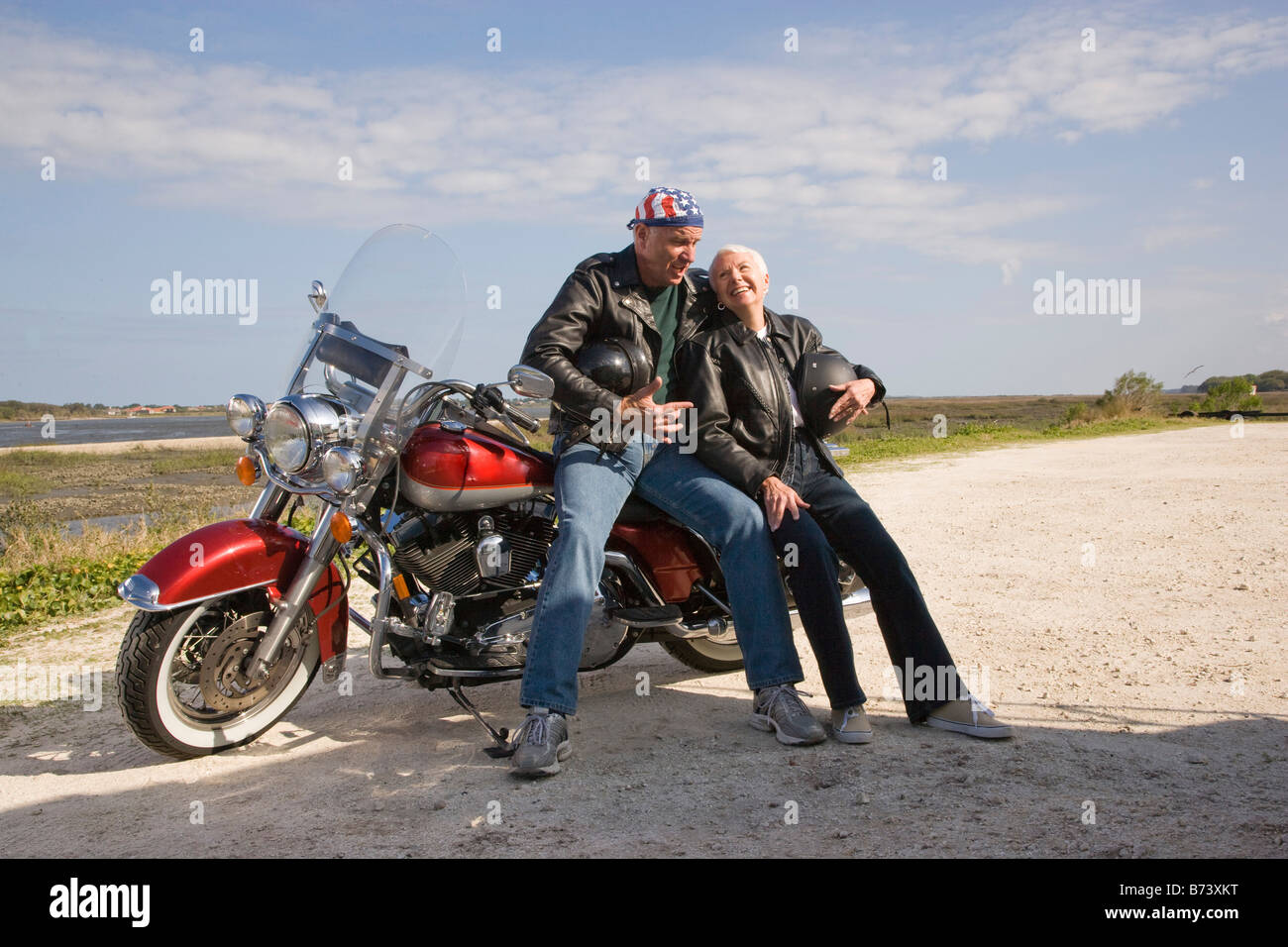 Woman leaning against motorcycle hi-res stock photography and images ...
