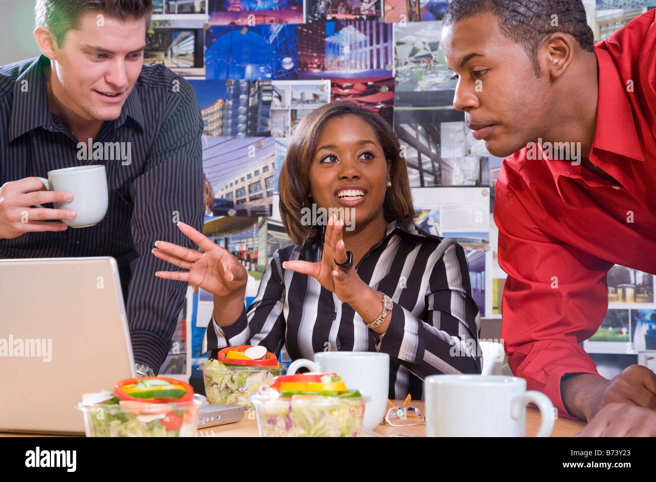 Office workers in meeting having a healthy working lunch Stock Photo ...
