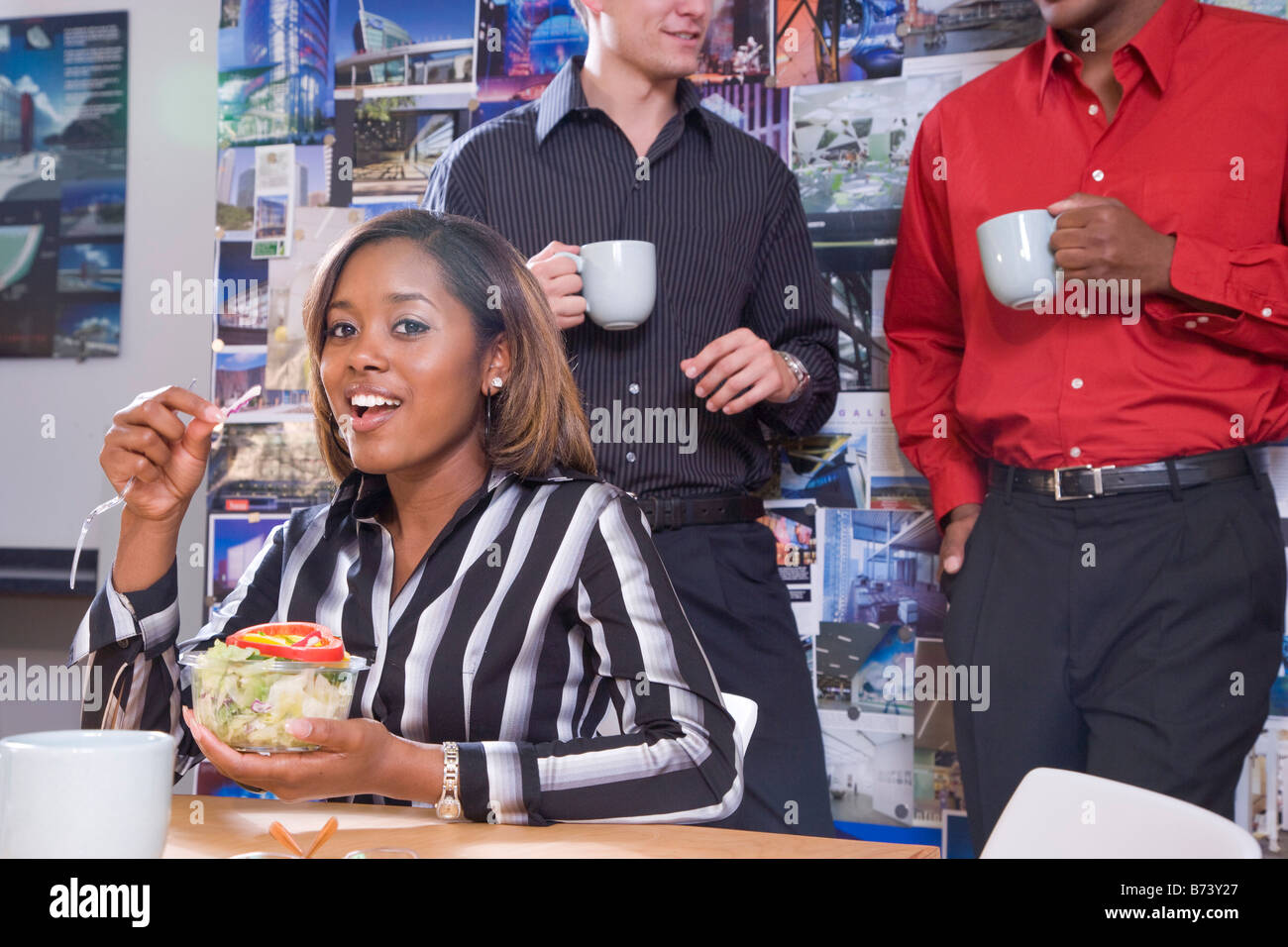 Office workers in meeting having a working lunch Stock Photo - Alamy