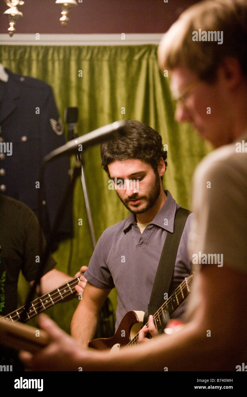 Three musicians playing guitars hi-res stock photography and images - Alamy