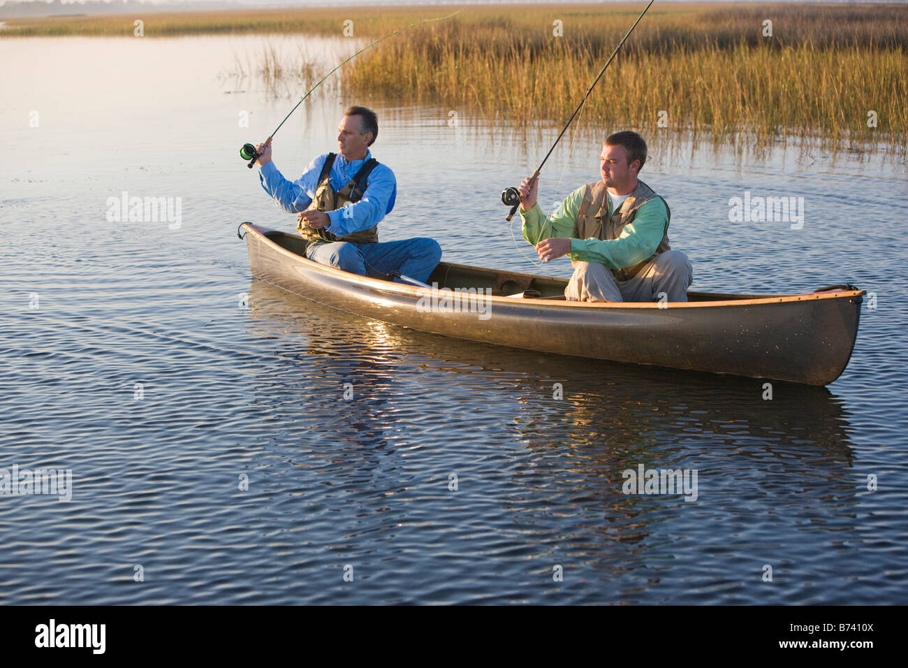 Men fishing in canoe on Florida Intracoastal Waterway Stock Photo - Alamy