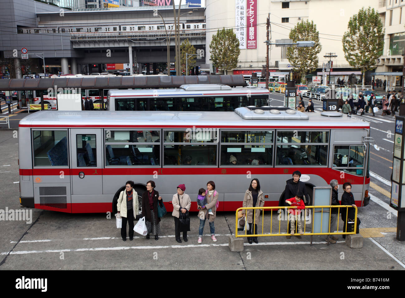 Passengers wait for a bus in Shibuya bus station in Tokyo Stock Photo ...