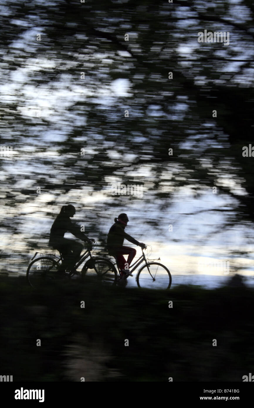 people riding fast bikes on rural lane countryside Stock Photo - Alamy
