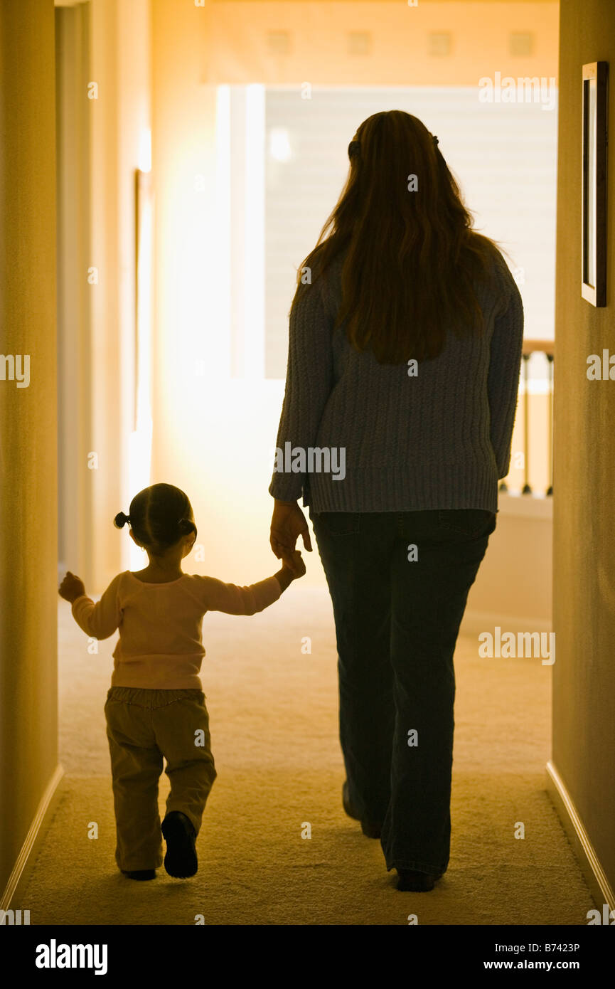 Mother daughter walking hallway hi-res stock photography and images - Alamy