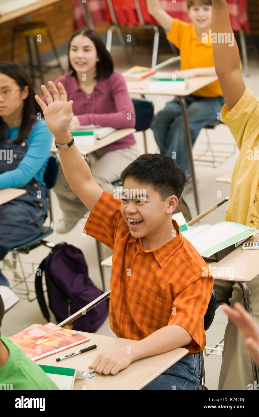 Happy asian boy raising hand hi-res stock photography and images - Alamy