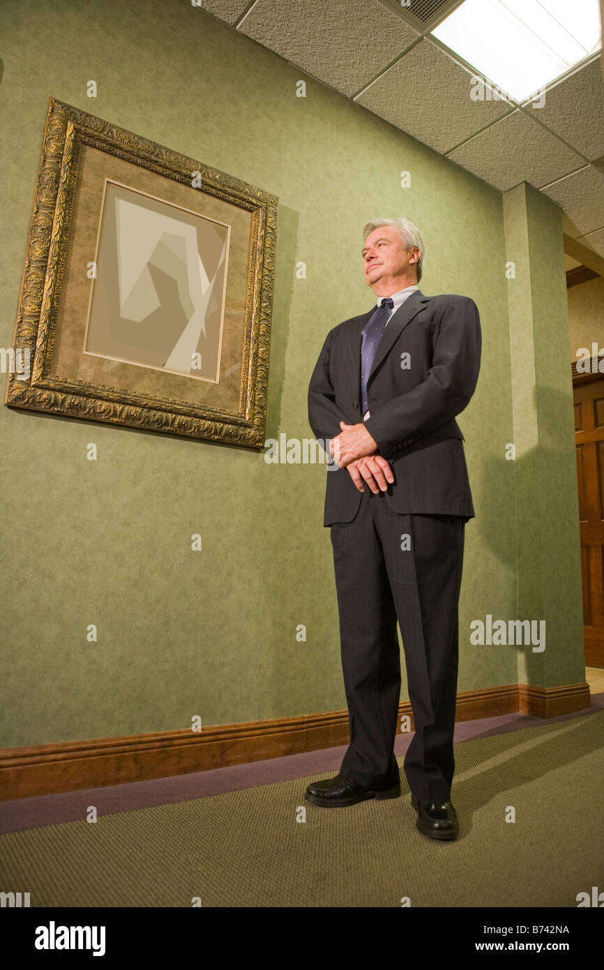 Business executive standing confidently in office, low angle view Stock ...