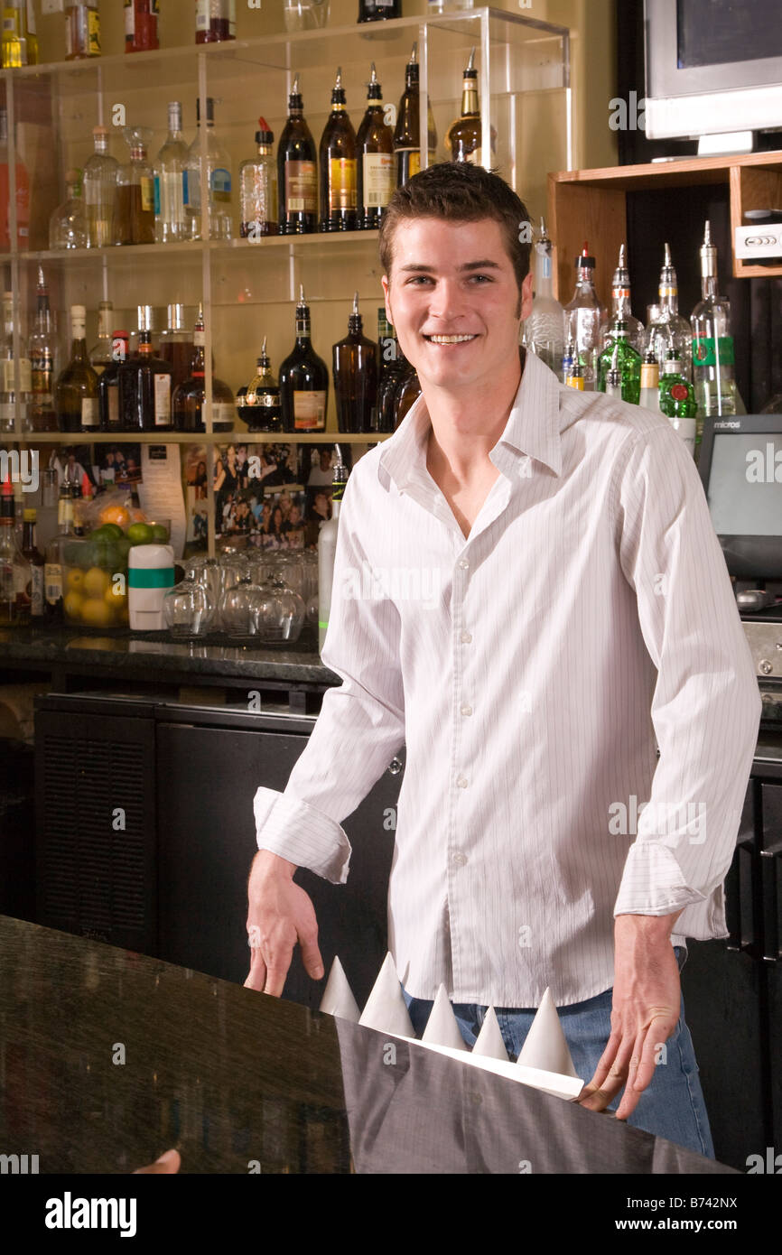 1 male person behind the counter serving hi-res stock photography and ...