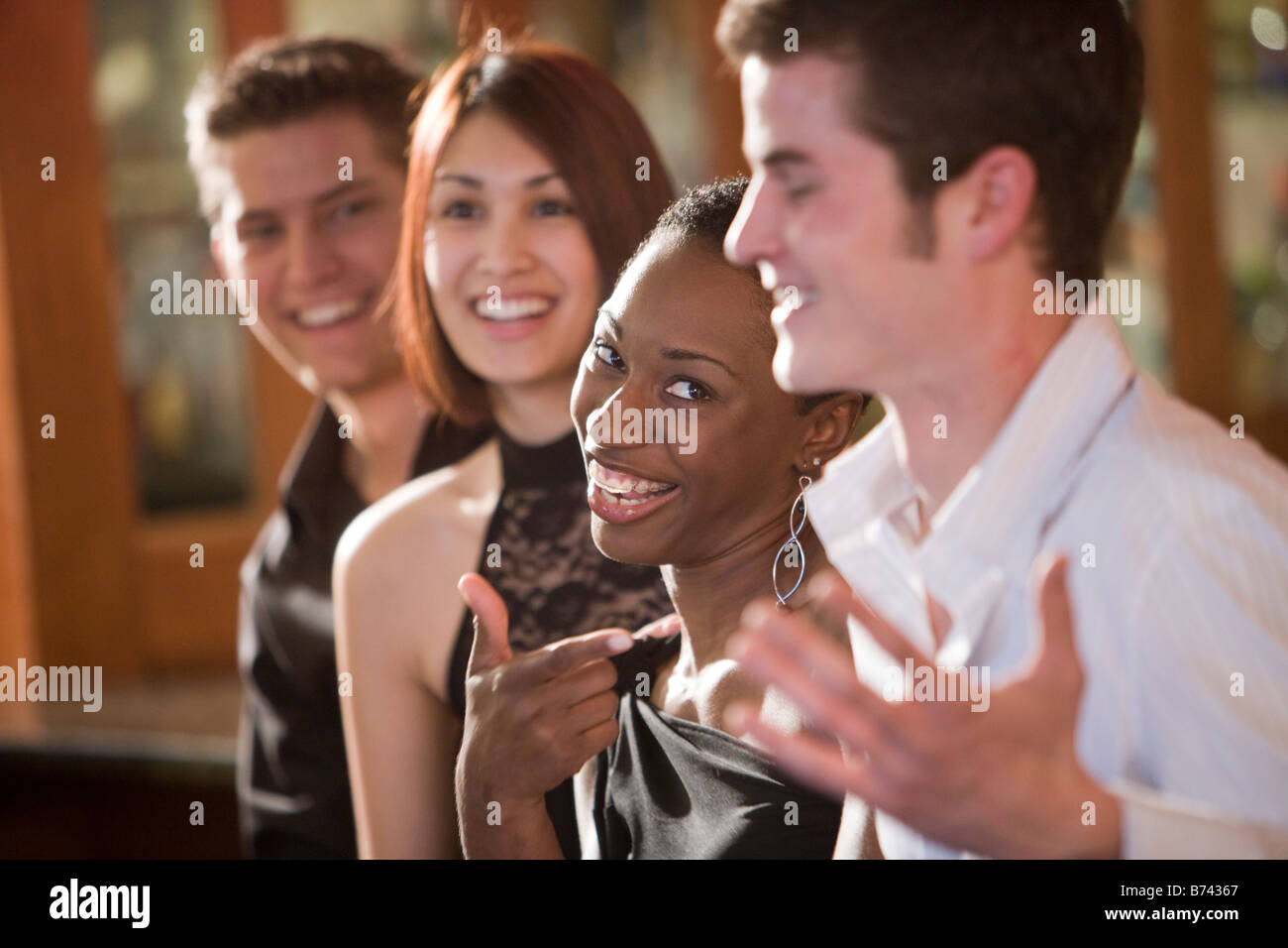Young African-American woman socializing with friends Stock Photo - Alamy