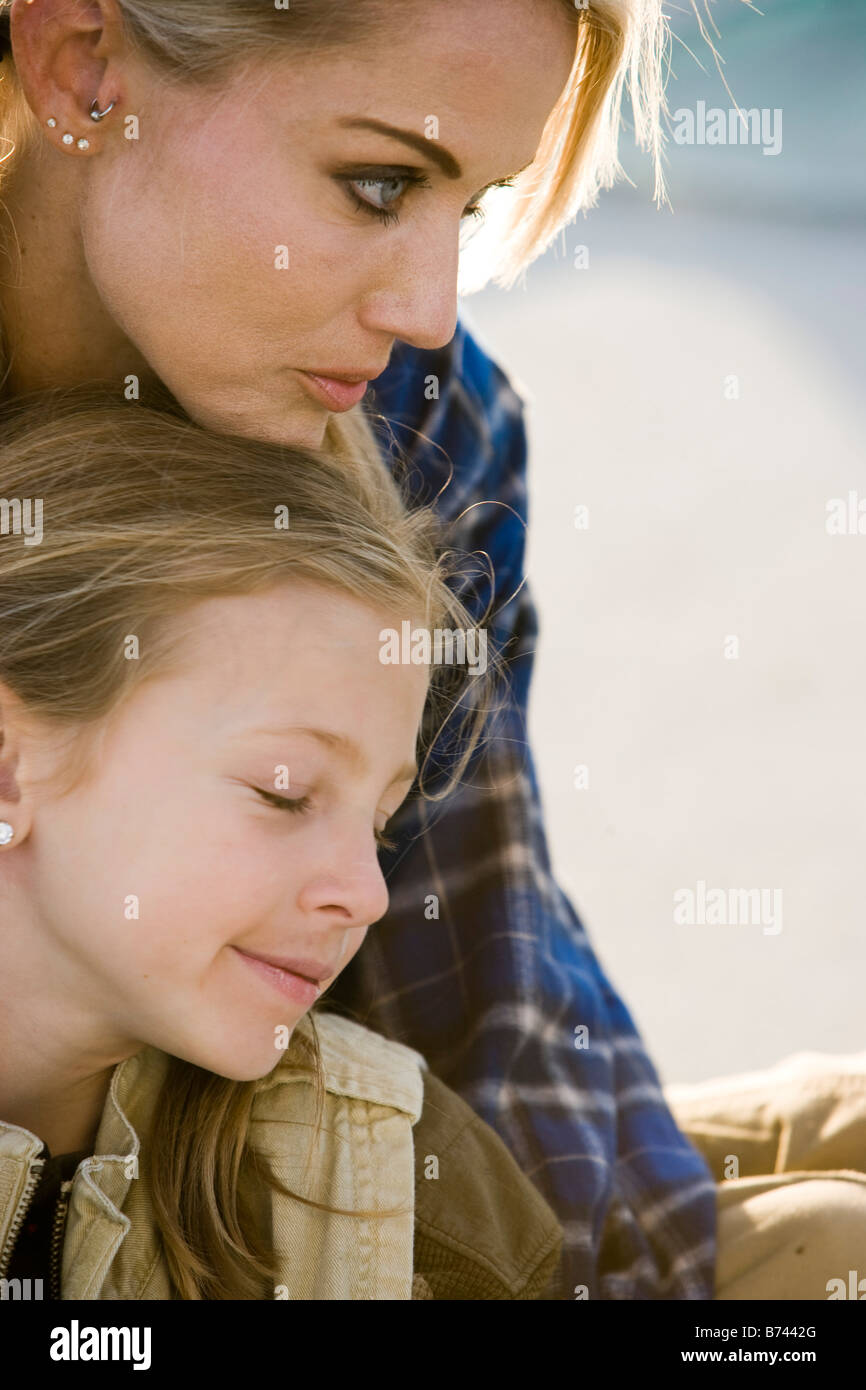 Close-up of mother embracing daughter Stock Photo - Alamy
