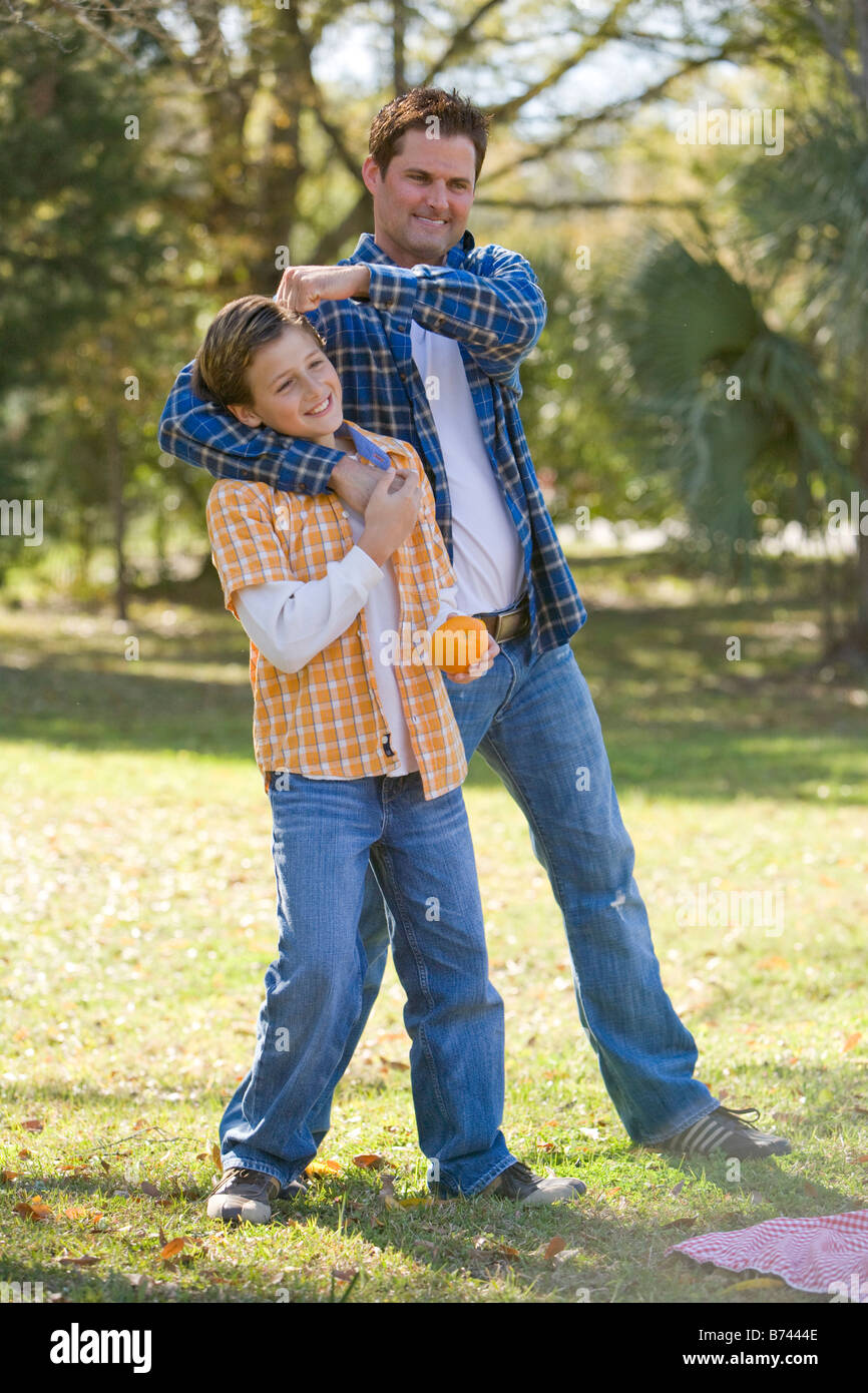 Happy father and son having fun in park Stock Photo - Alamy