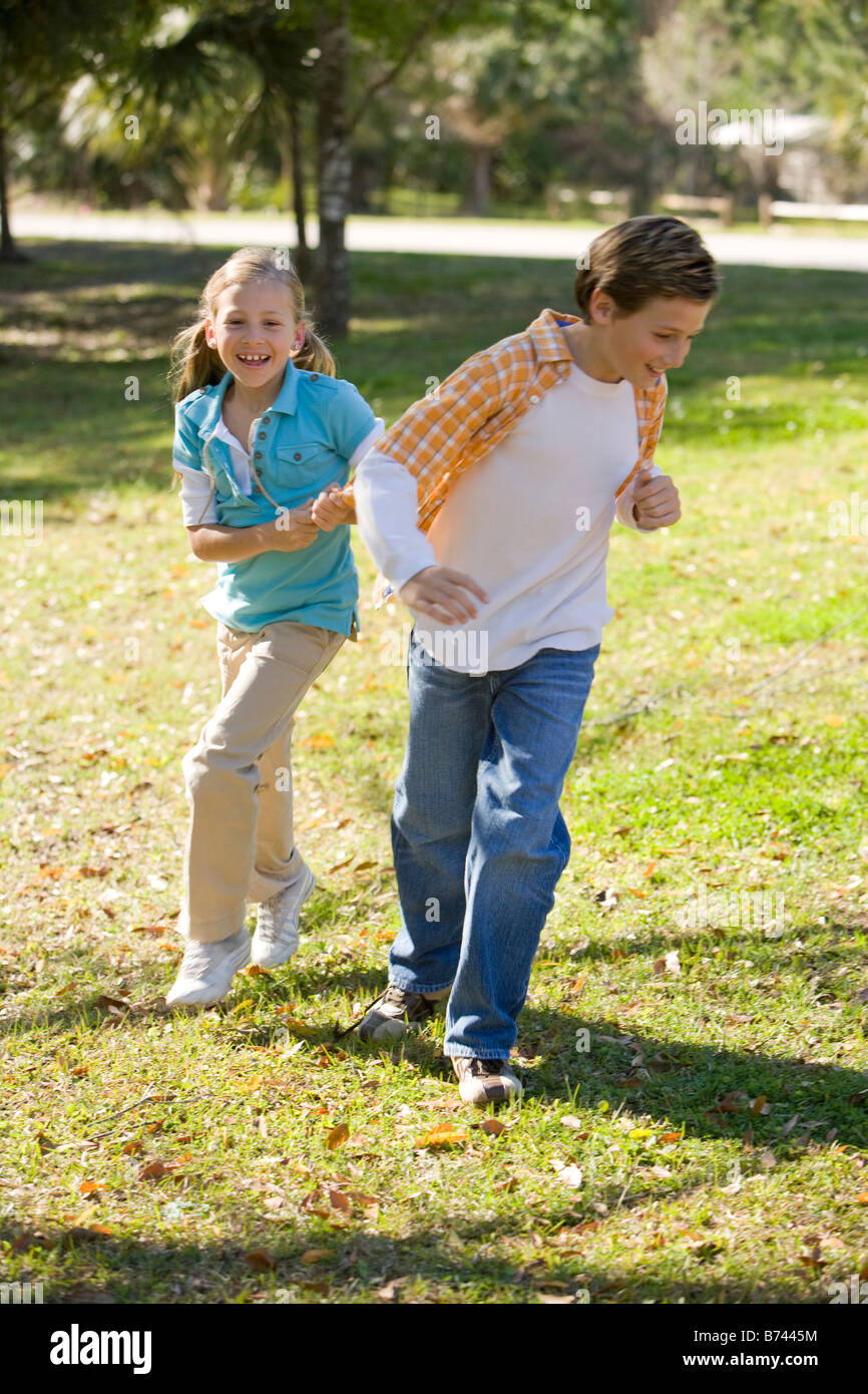 Happy children playing together park hi-res stock photography and ...