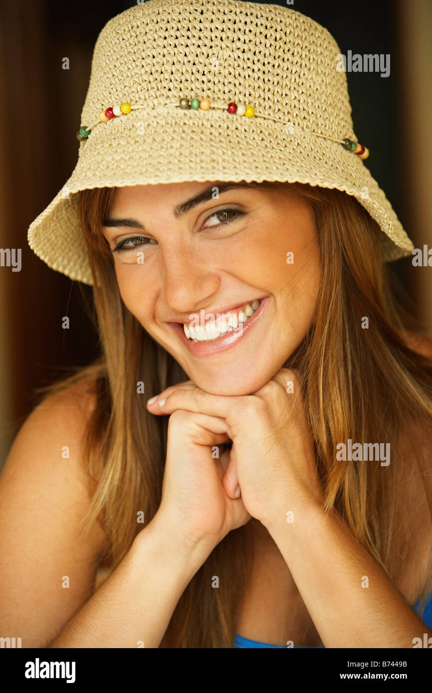 Smiling woman wearing straw hat Stock Photo - Alamy