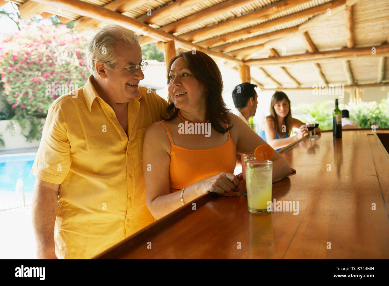 Hispanic couple drinking in bar Stock Photo - Alamy