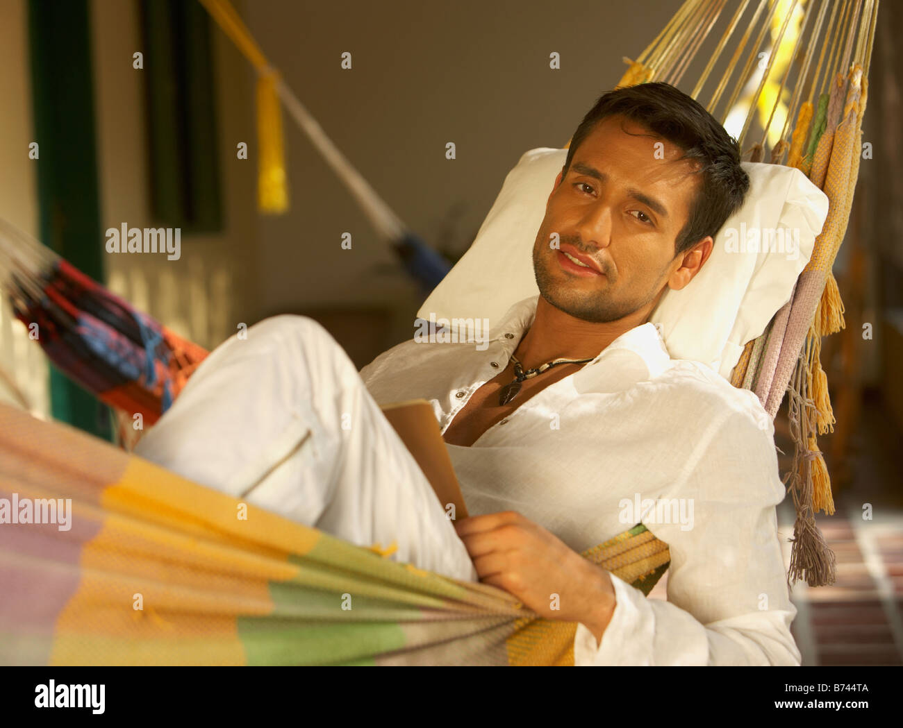 Man laying in hammock Stock Photo - Alamy