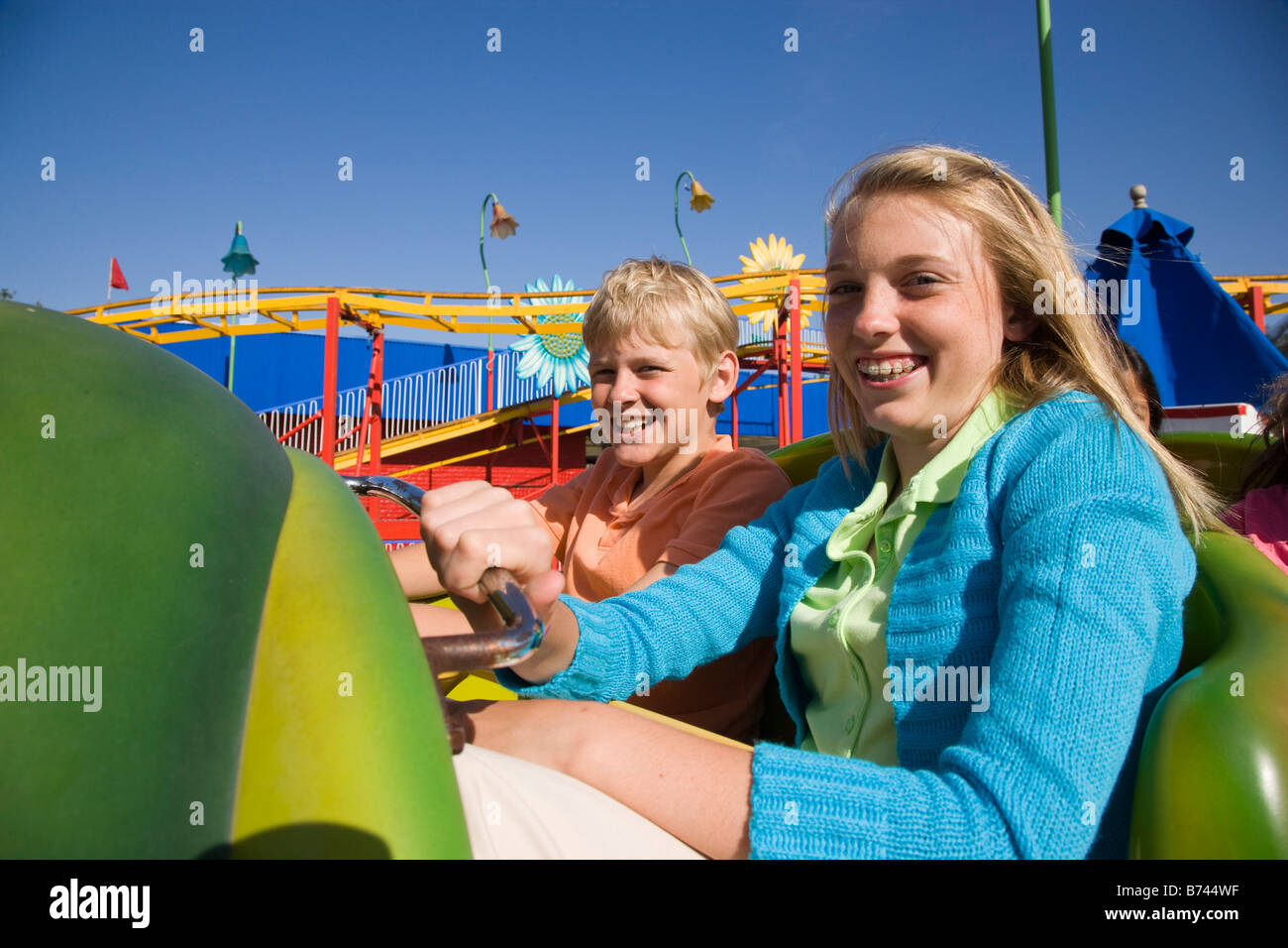 Children riding a roller coaster hi-res stock photography and images ...