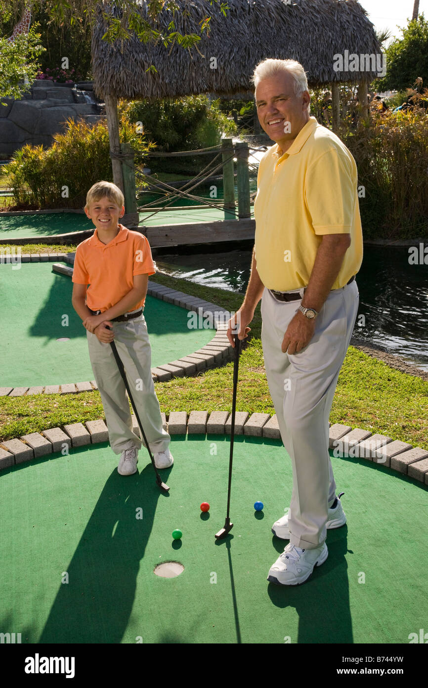 Grandfather grandson playing golf hi-res stock photography and images ...
