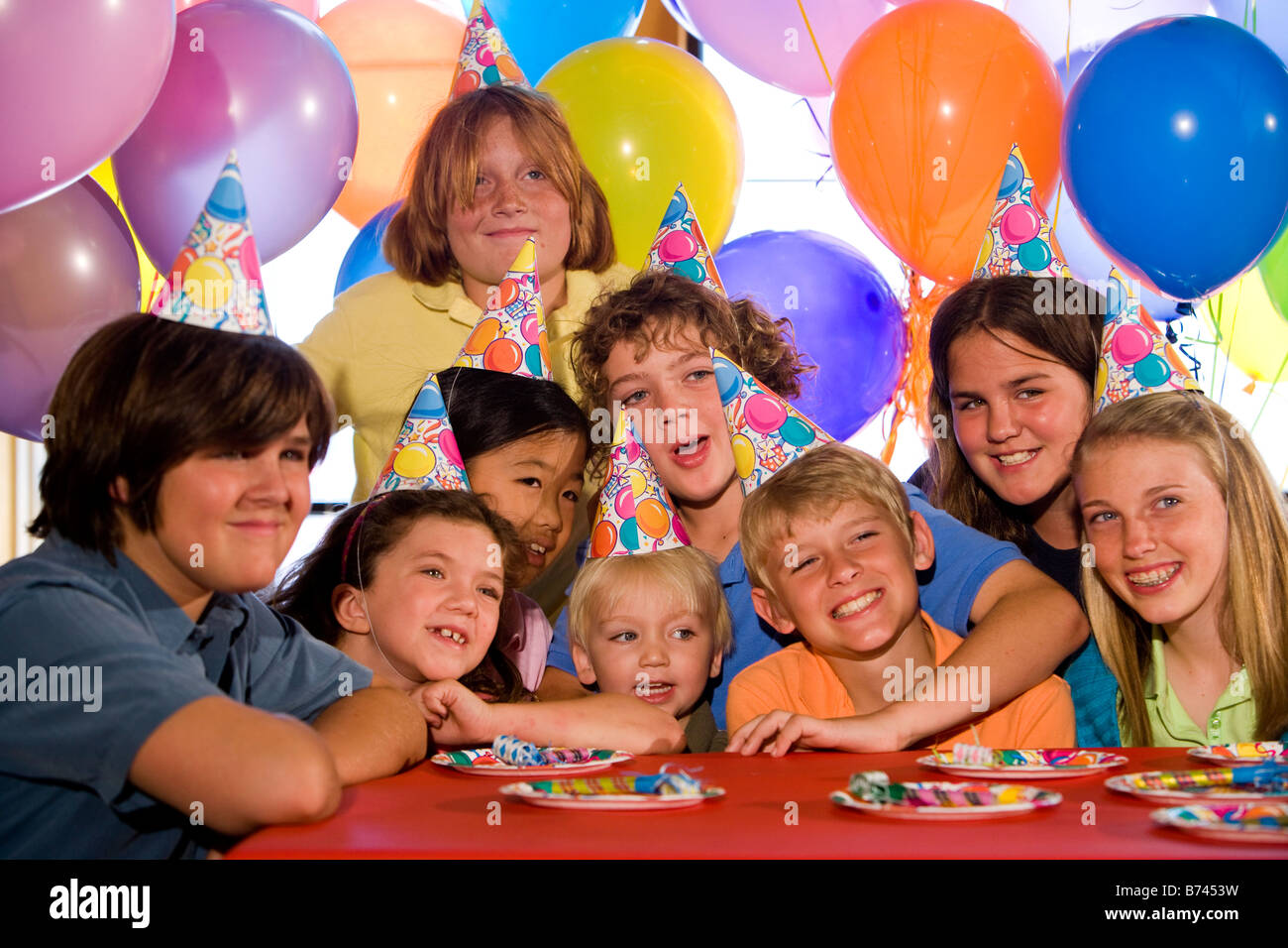 Kids having fun at birthday party with balloons Stock Photo - Alamy