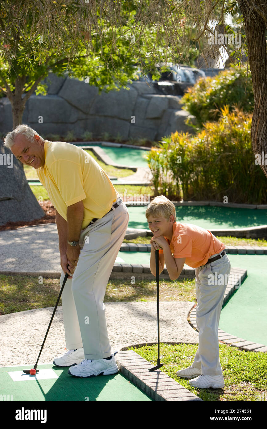 Parent and child playing golf hi-res stock photography and images - Alamy