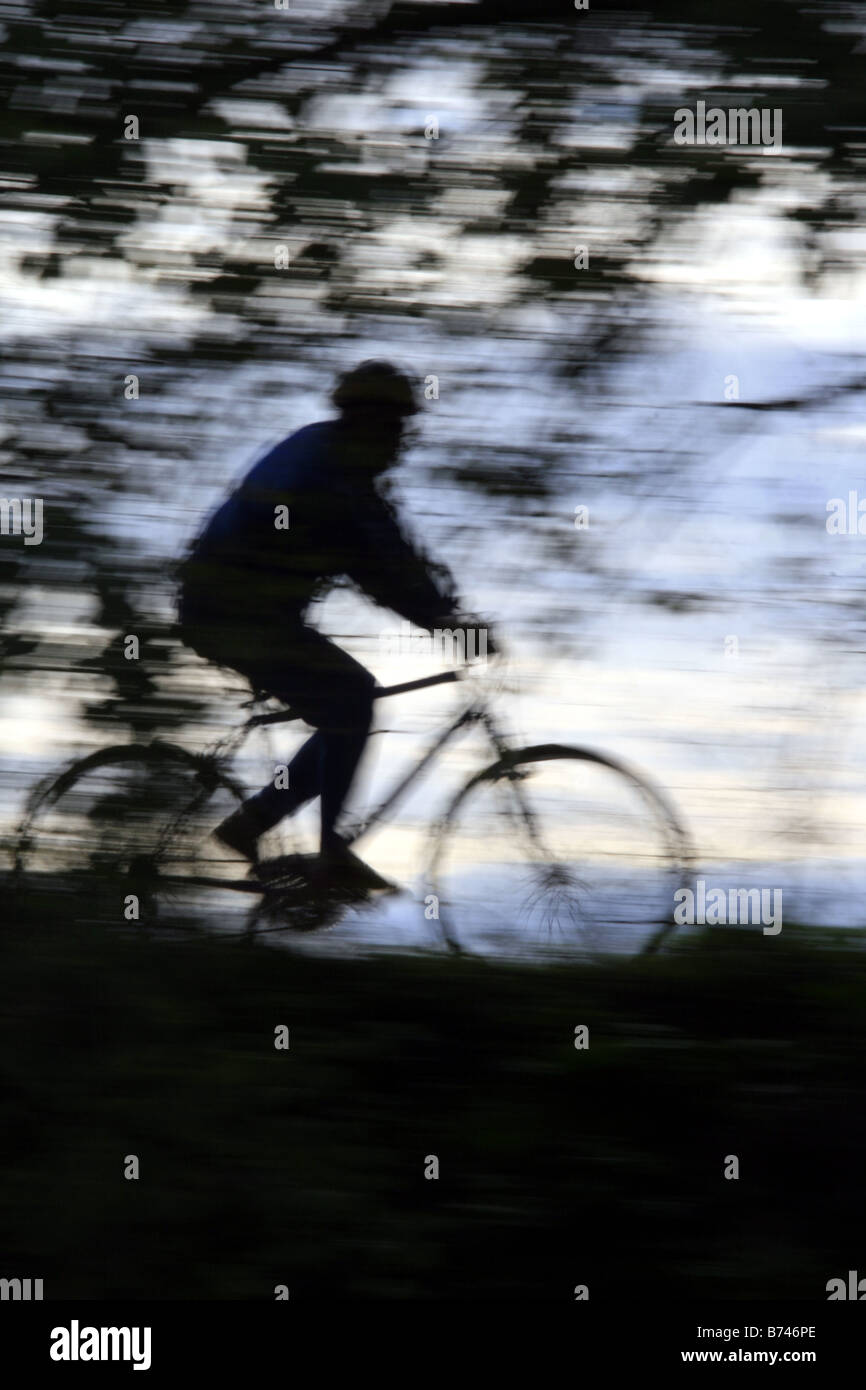 person riding fast bike on rural lane countryside Stock Photo - Alamy