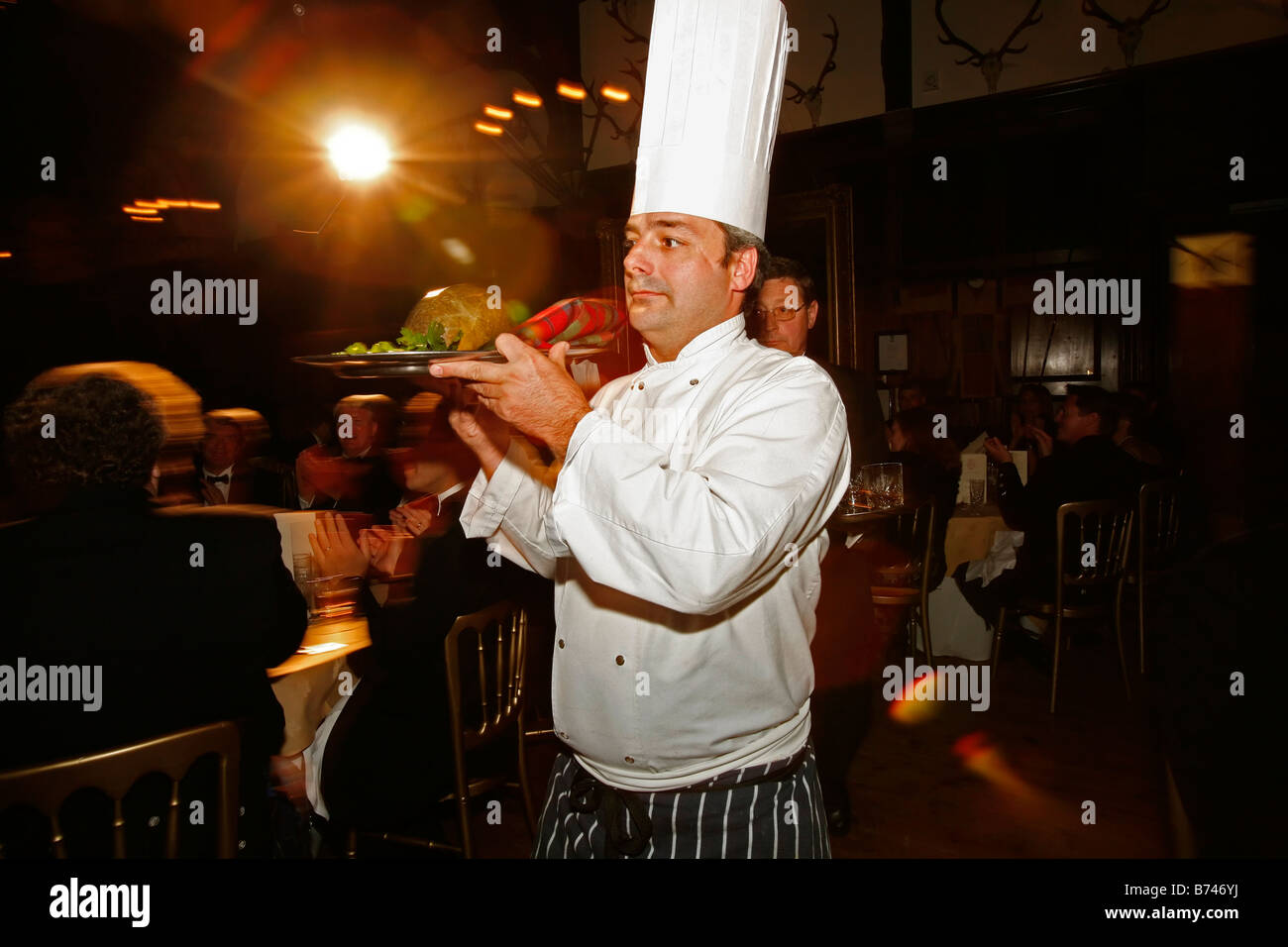 The chef brings in the haggis at a traditional Burns Night supper Stock ...