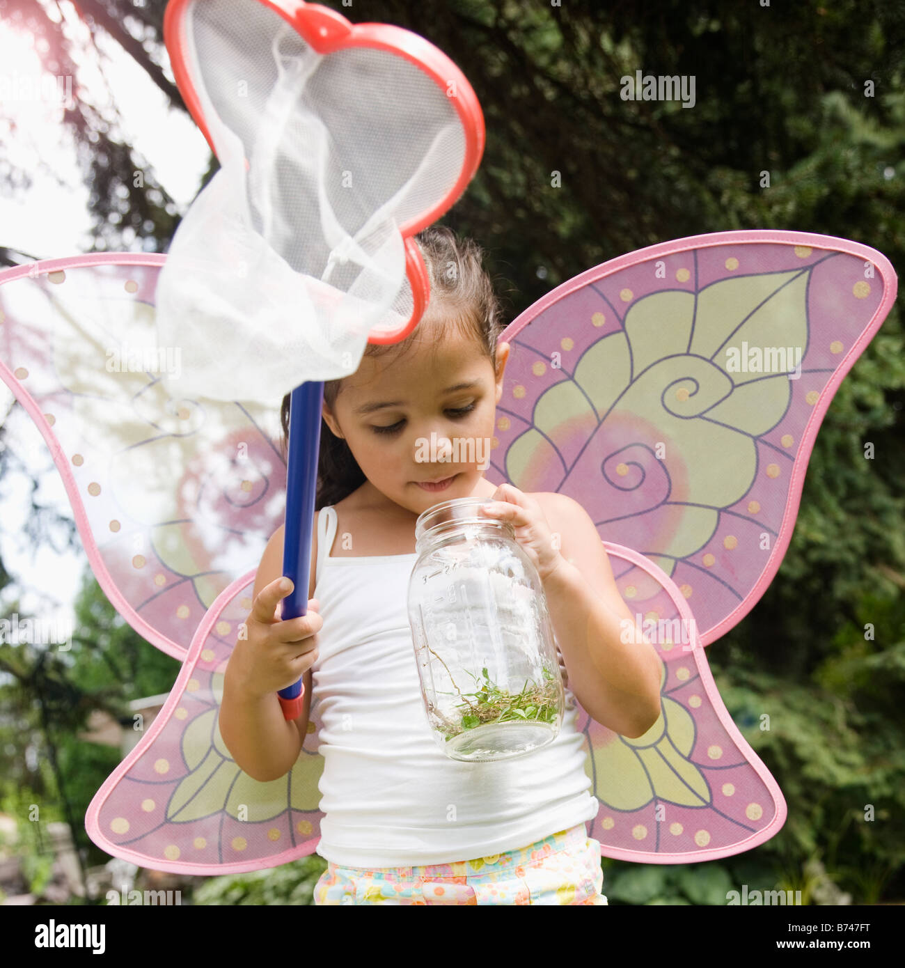 Girl catching butterfly hi-res stock photography and images - Alamy