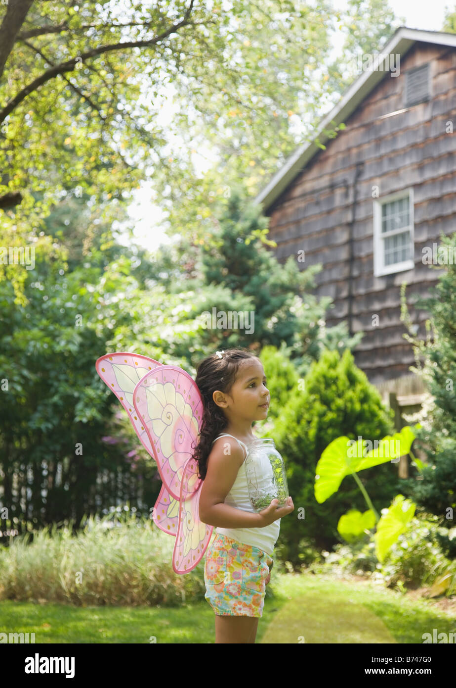 Girl catching butterfly hi-res stock photography and images - Alamy