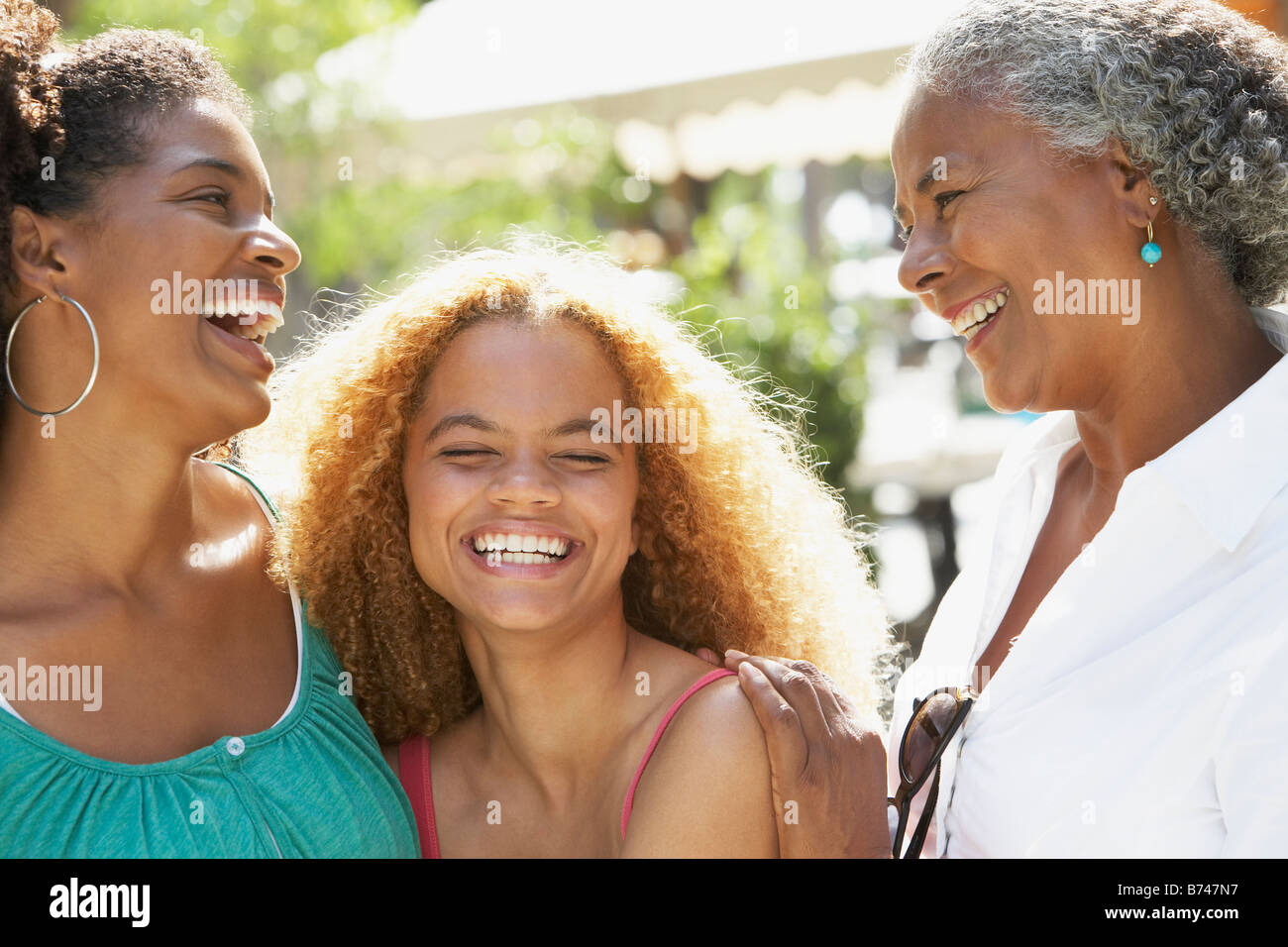 Multi-generational women laughing Stock Photo - Alamy