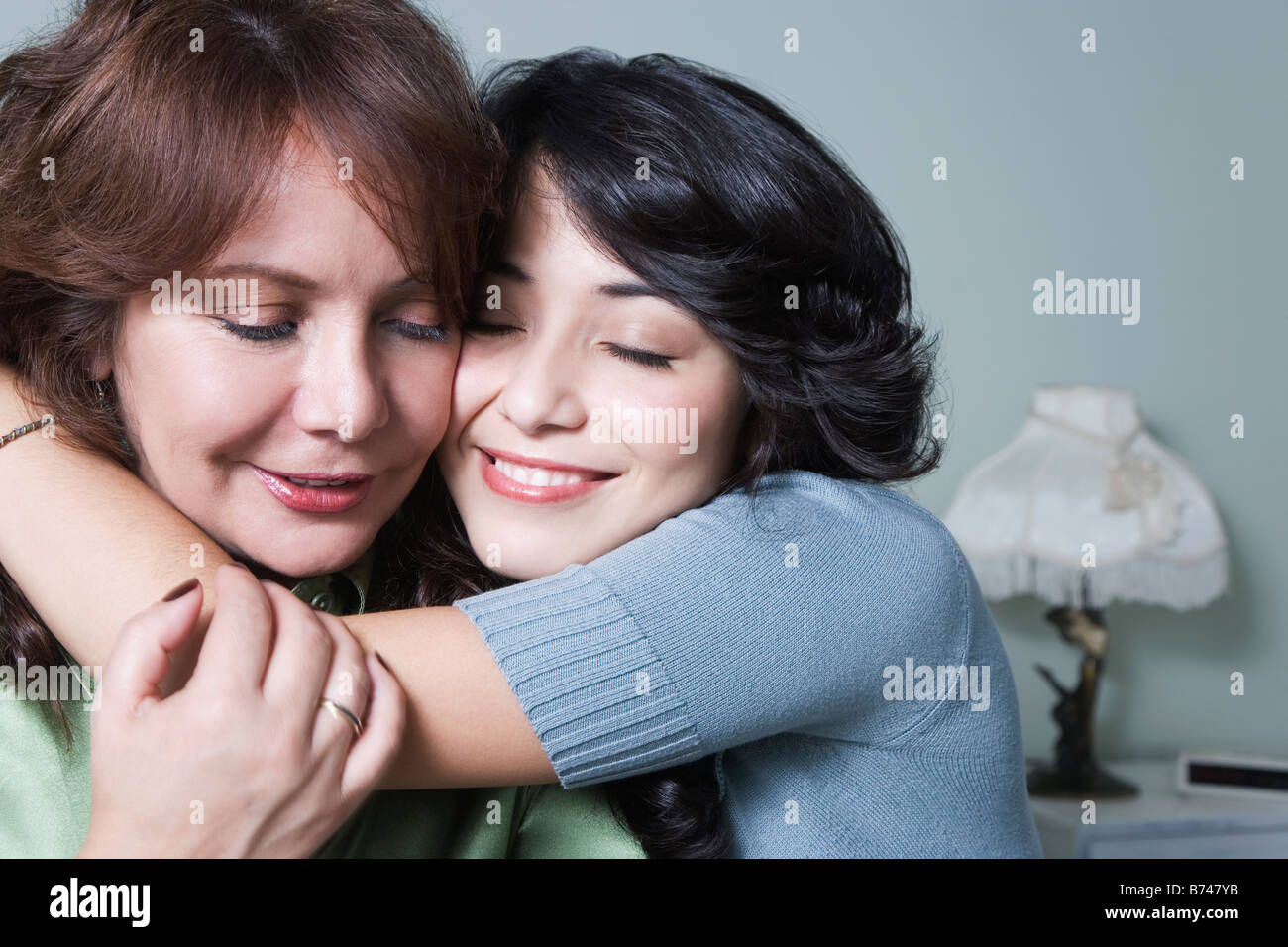 Young woman hugging mother Stock Photo - Alamy