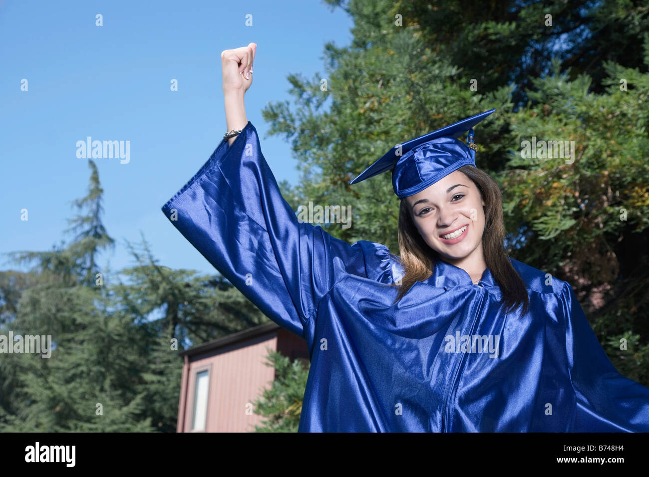 Mixed race girl celebrating graduation Stock Photo - Alamy