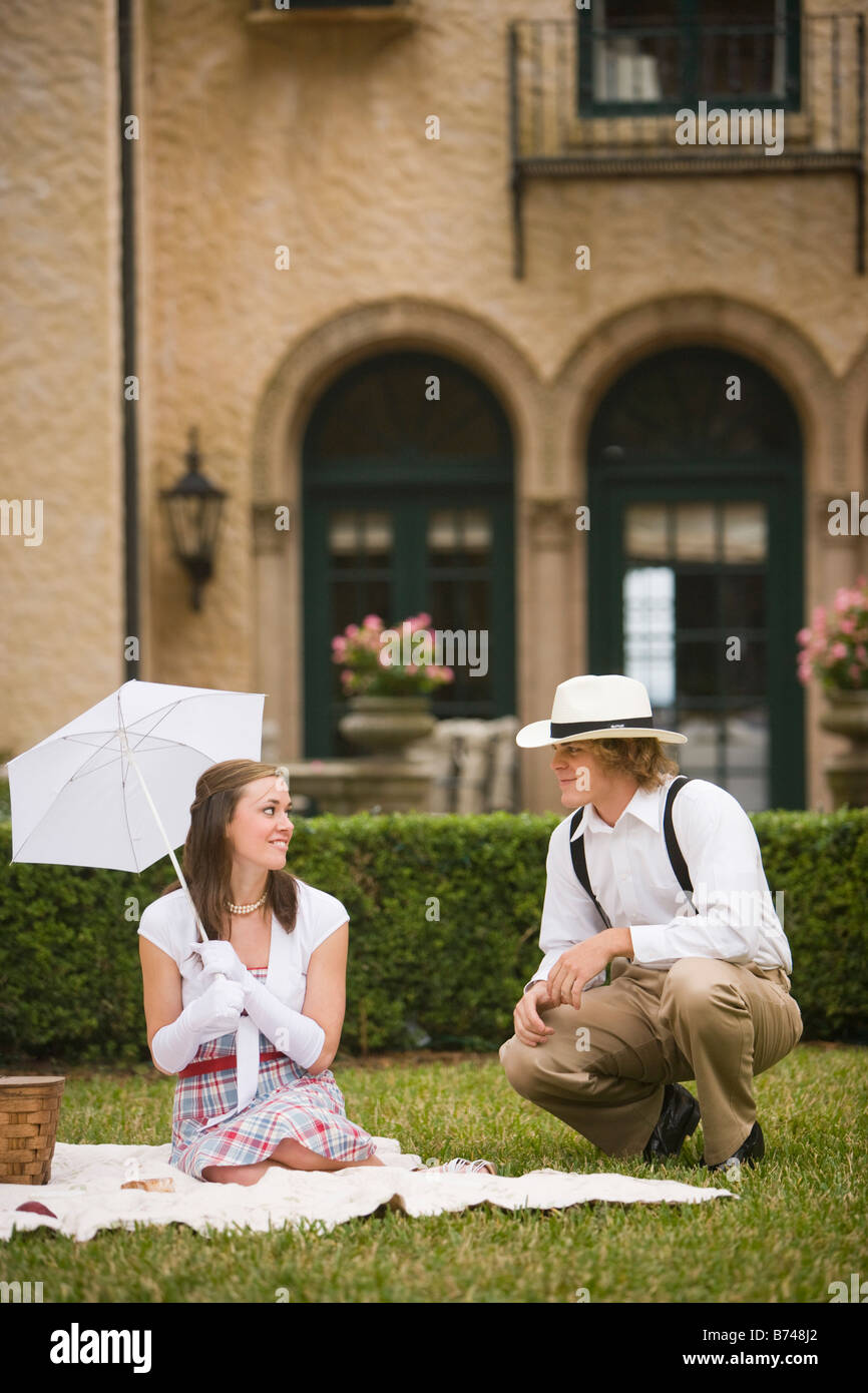 Fashionable young couple having outdoor picnic Stock Photo - Alamy