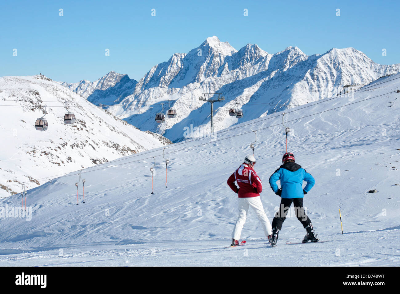 a young boy getting skiing lessons at mountain station Gamsgarten at ...