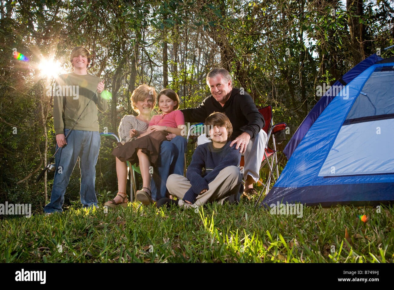 Portrait of family together on camping trip at campsite Stock Photo - Alamy