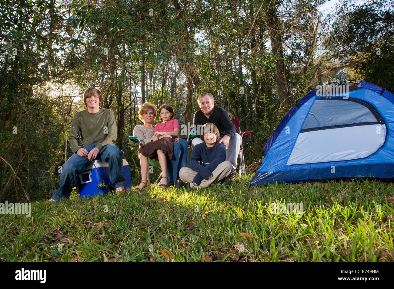 Portrait of family together on camping trip at campsite Stock Photo - Alamy