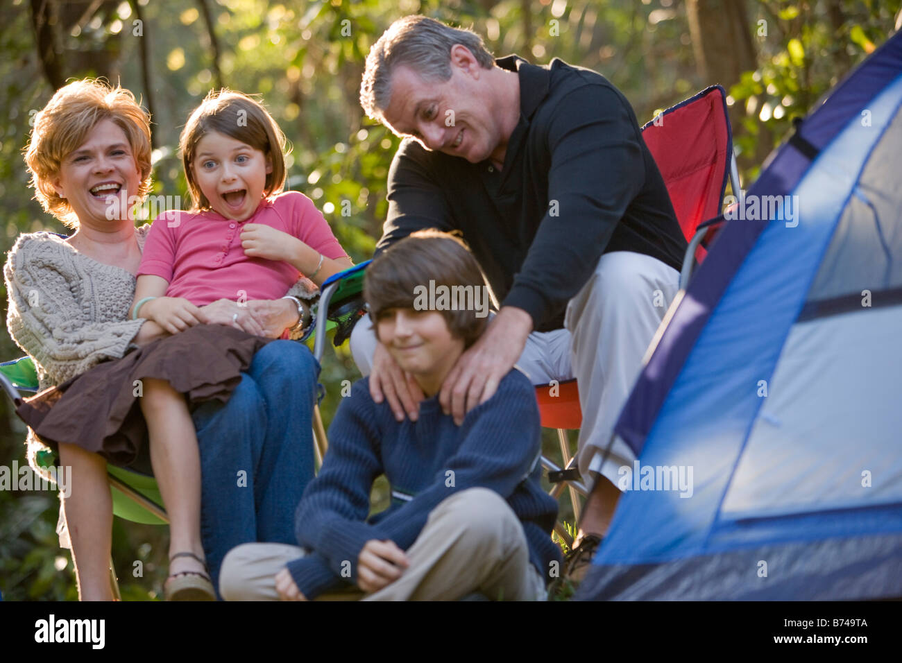 Portrait of family together on camping trip at campsite Stock Photo - Alamy